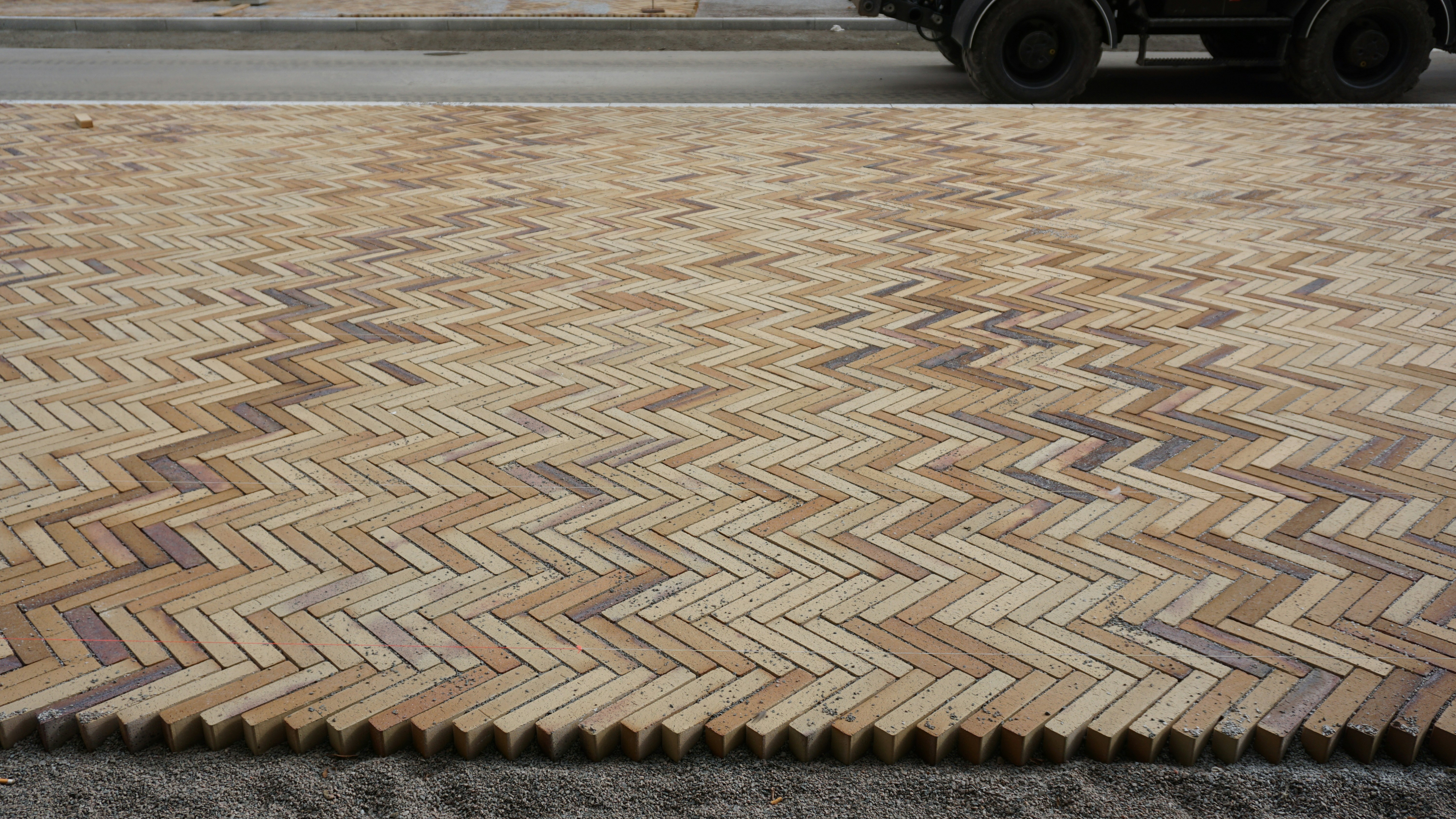Herringbone Ground: A Quiet Street Mosaic