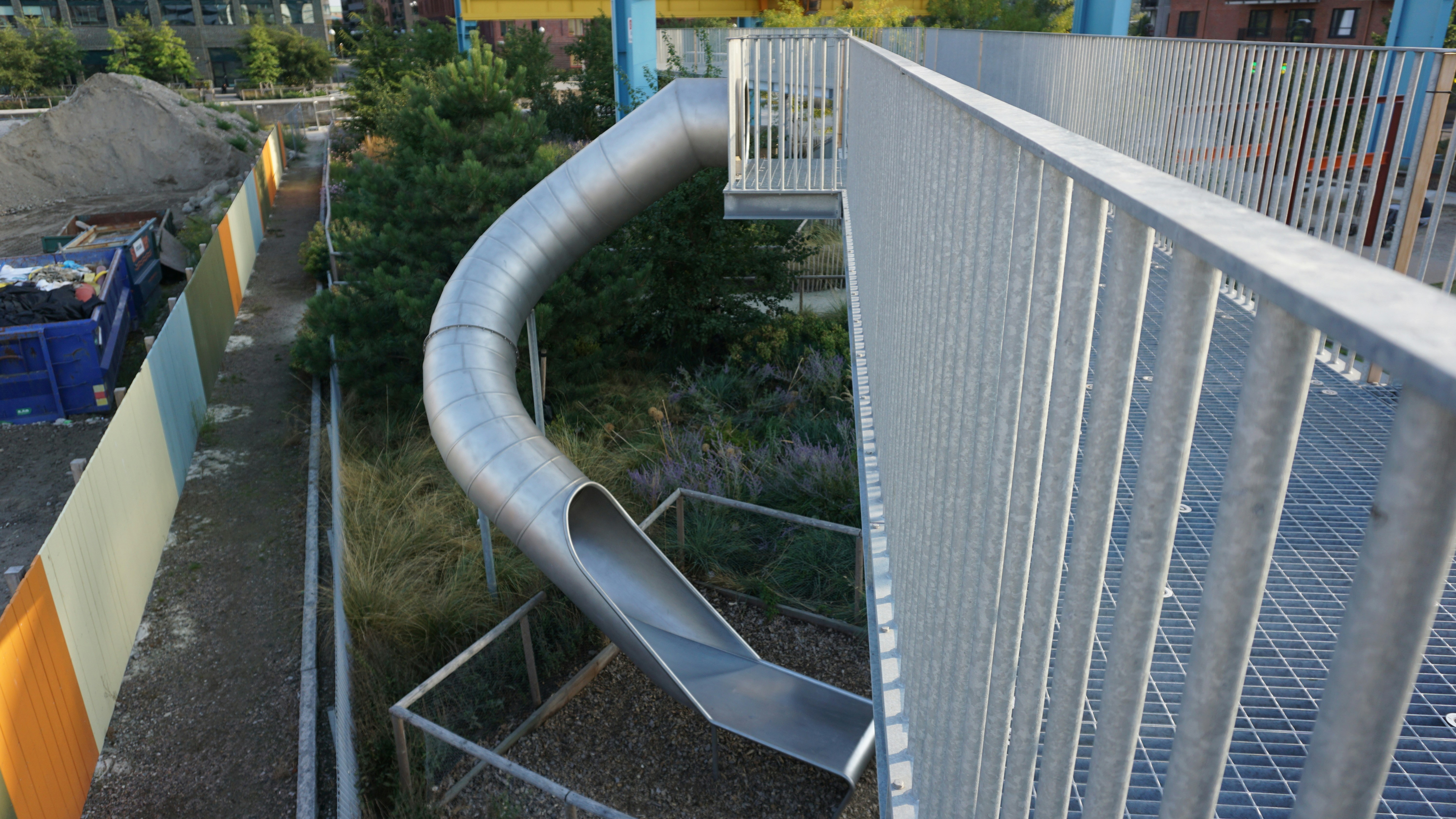 Curved Slides, Quiet Playground: A Glimpse Down the Park Corridor