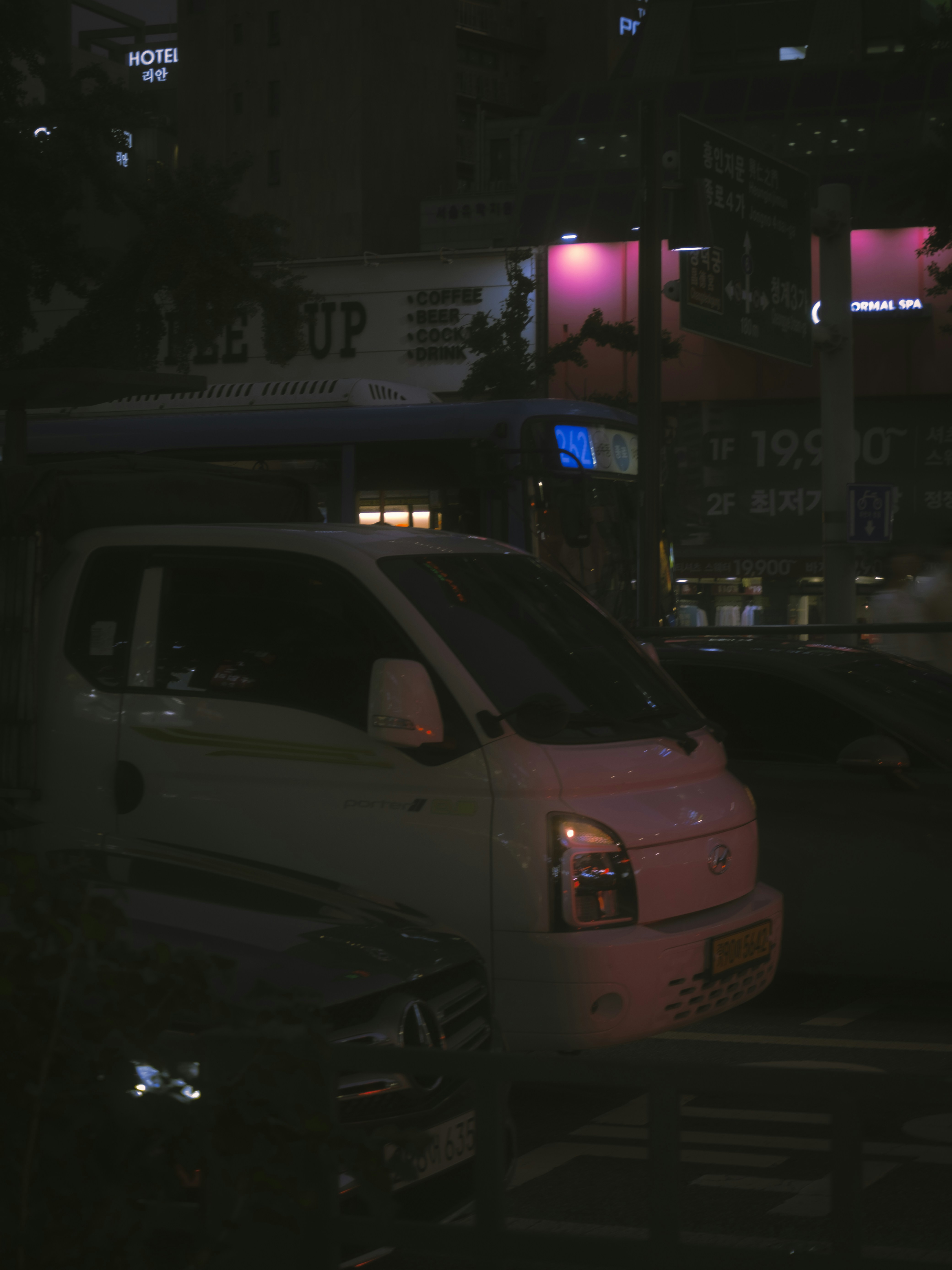  Neon-lit Mini Bus at a Bustling Night Market