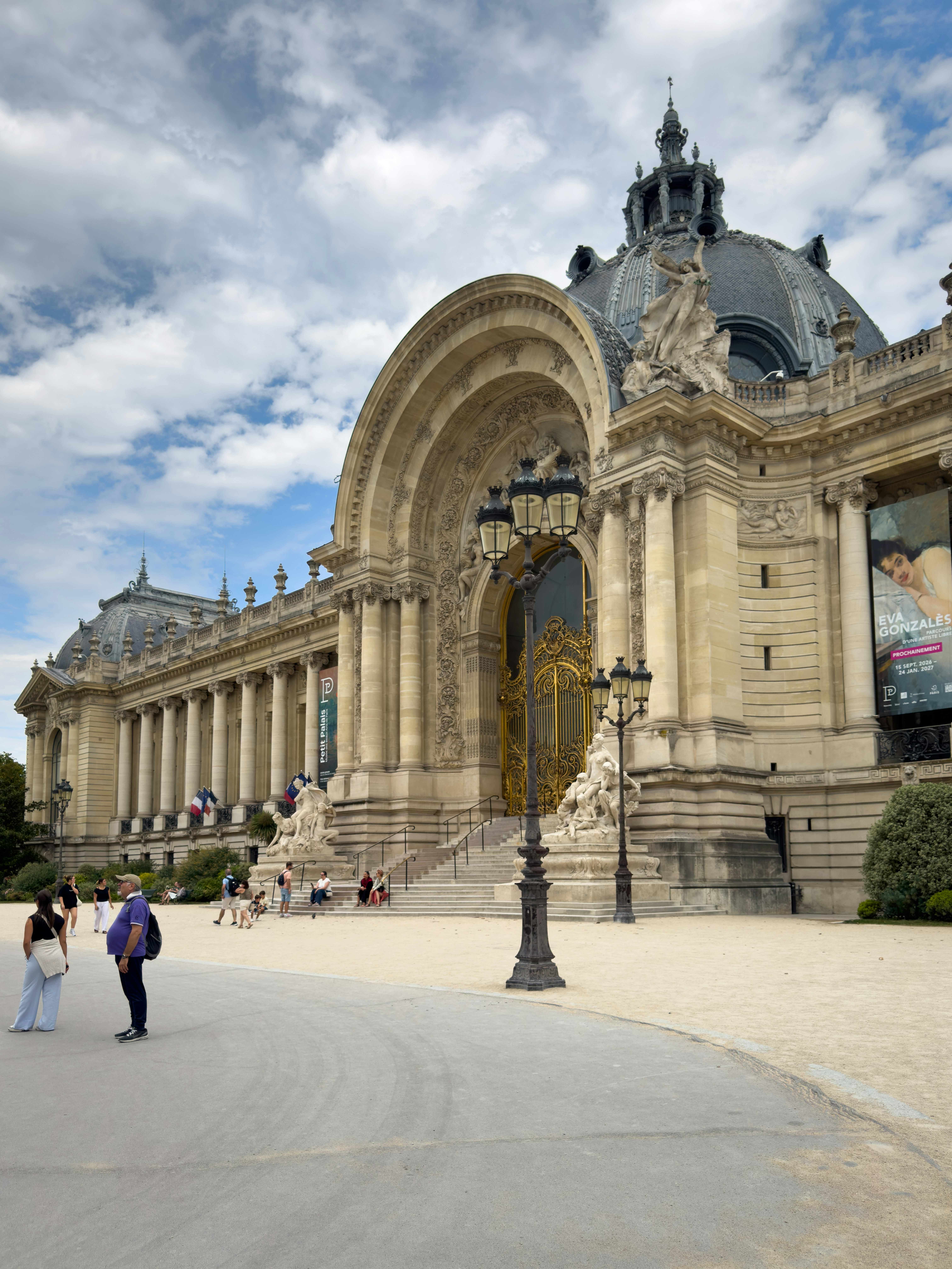 Ornate Parisian Facade: Grand Arch and Entrance from the Plaza