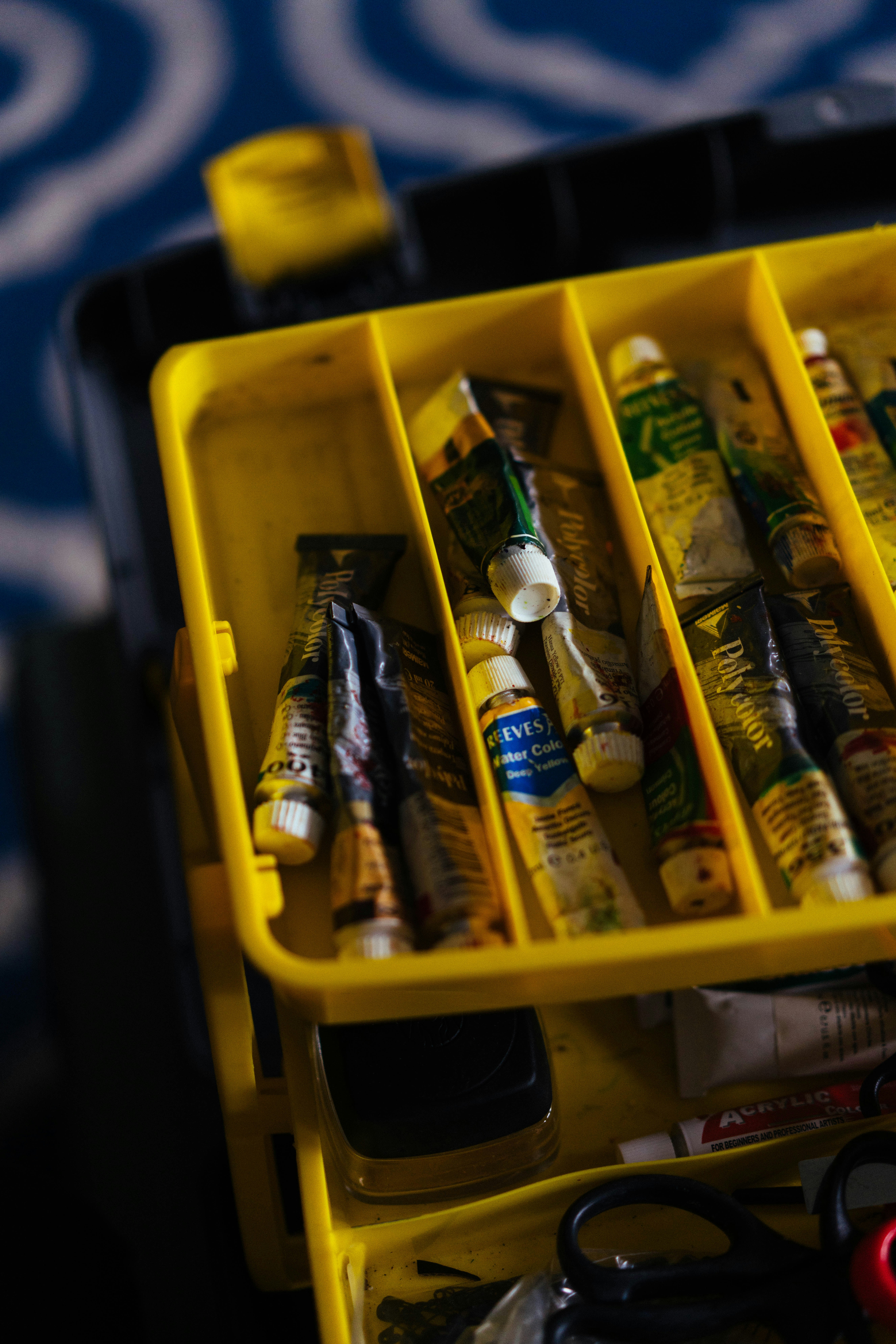 Yellow Tool Keeper: A Tangle of Oil Tubes and Caps