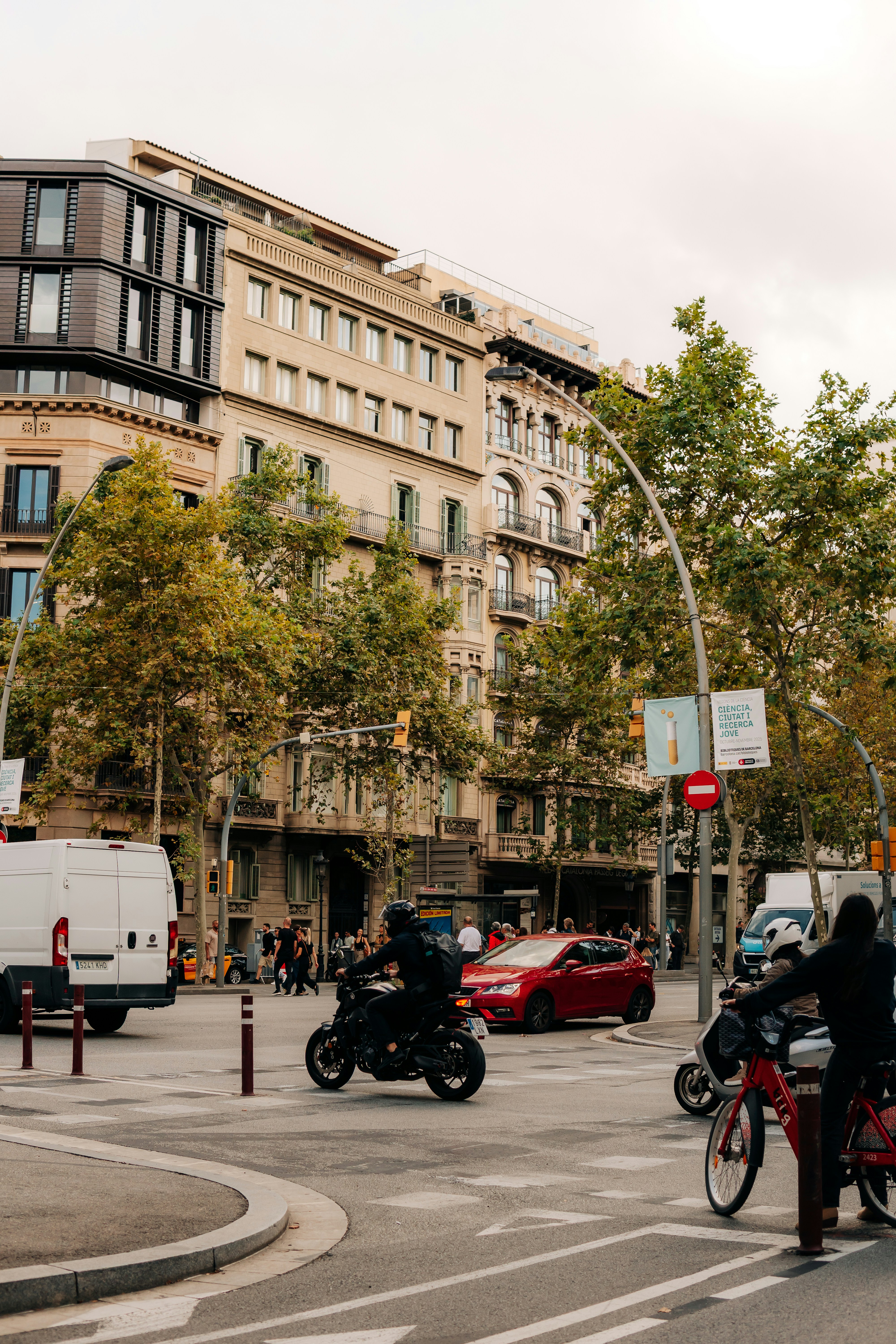 City Junction: Motorbikes and Buses in Motion by the Arcaded Street