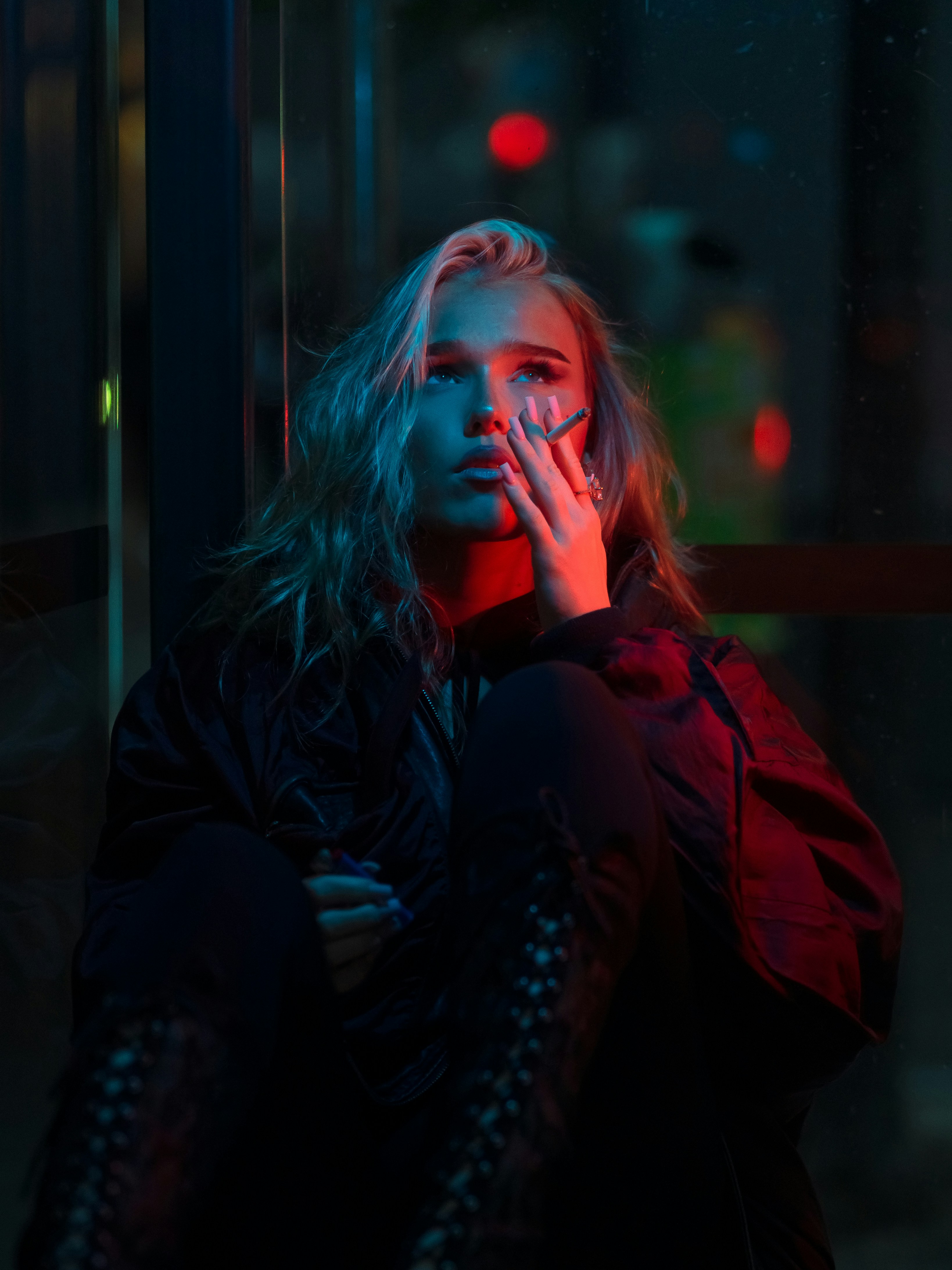 Neon Mirage: Quiet Intensity in a Darkened Transit Space