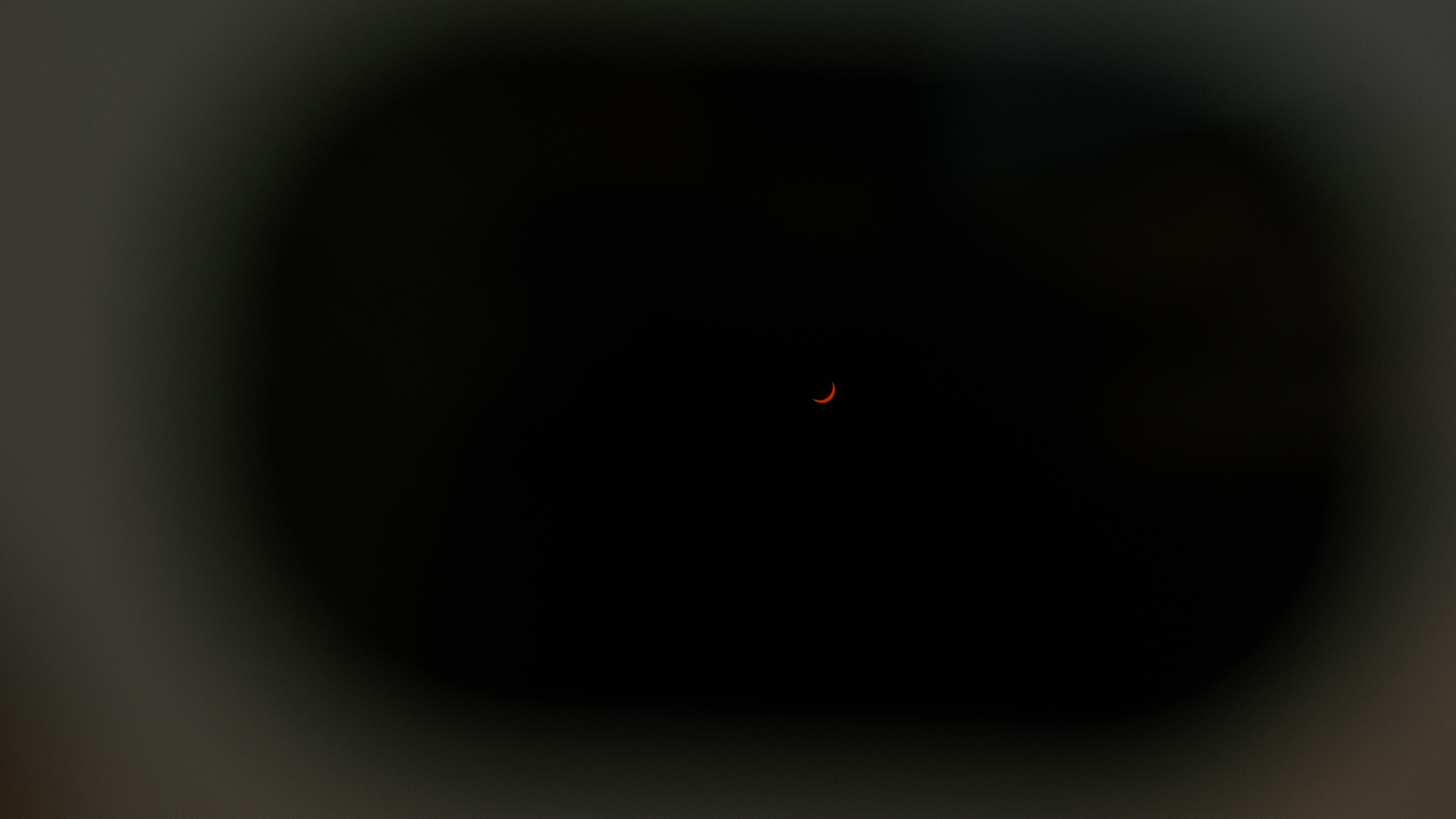 Tiny Crescent in the Dark: A Subtle Glint Amid Stellar Darkness