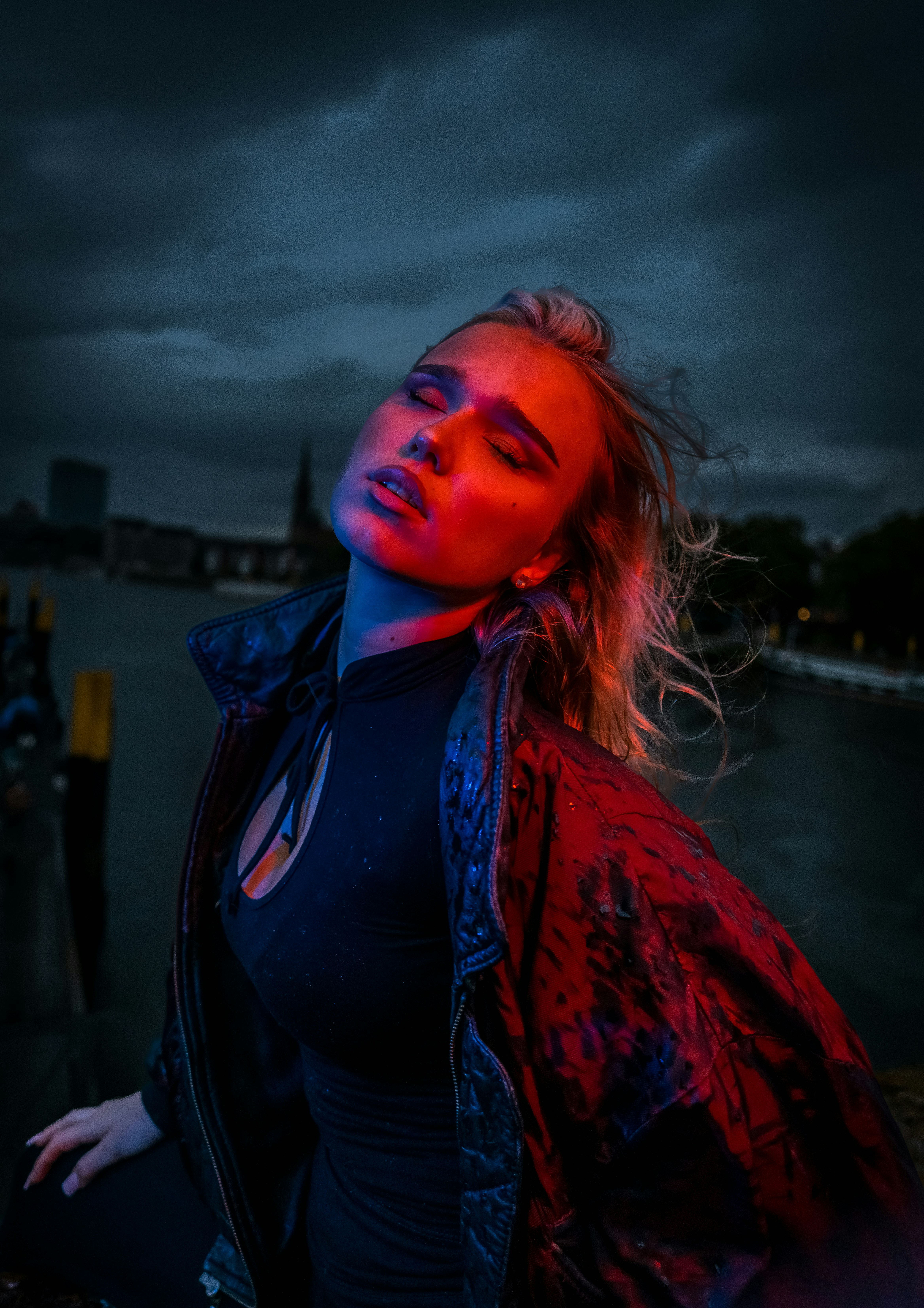 Portait under Neon Roofs: Blue Shadows and Red Purlieu
