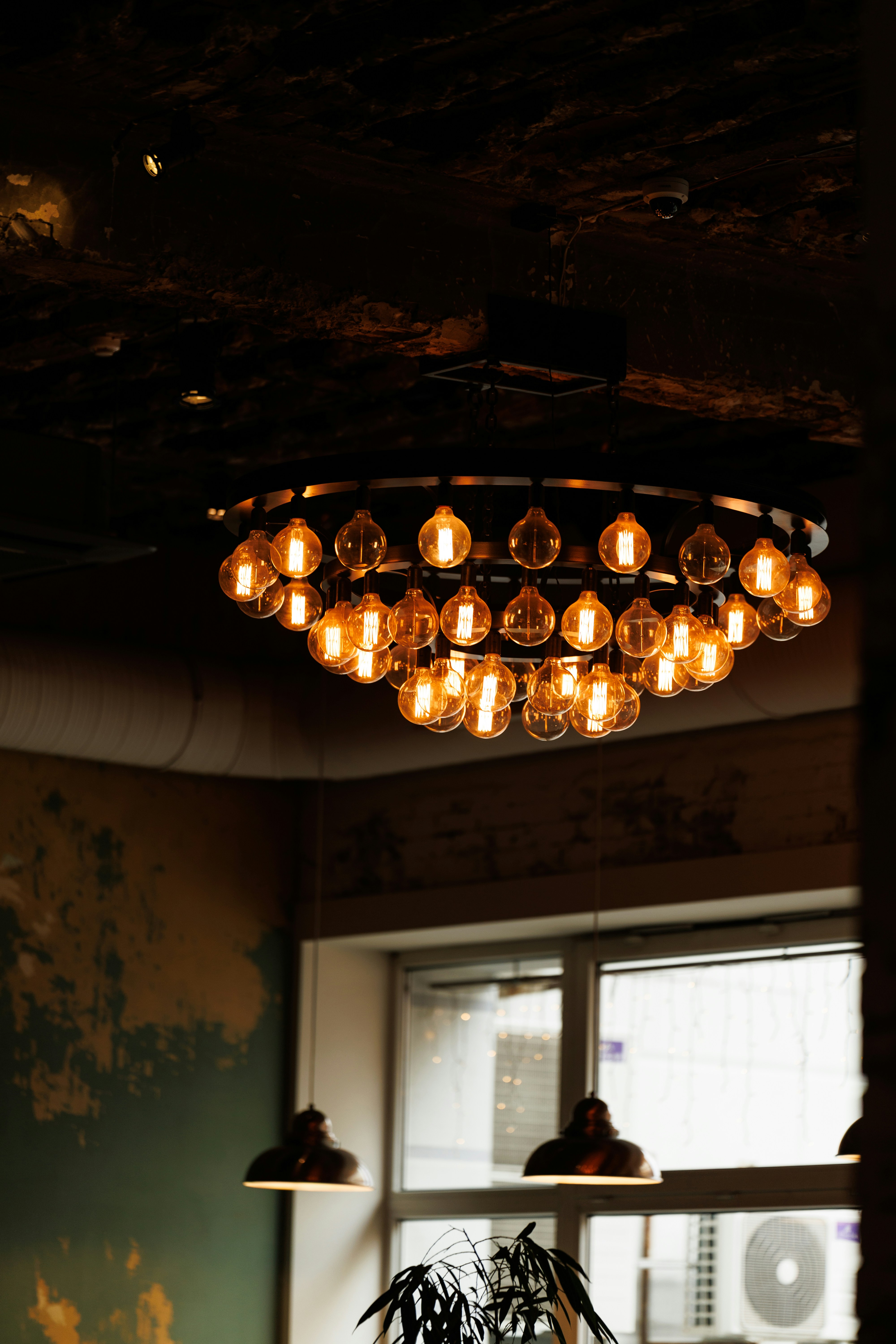 Warm Orbs Over a Dim Loft Cafe