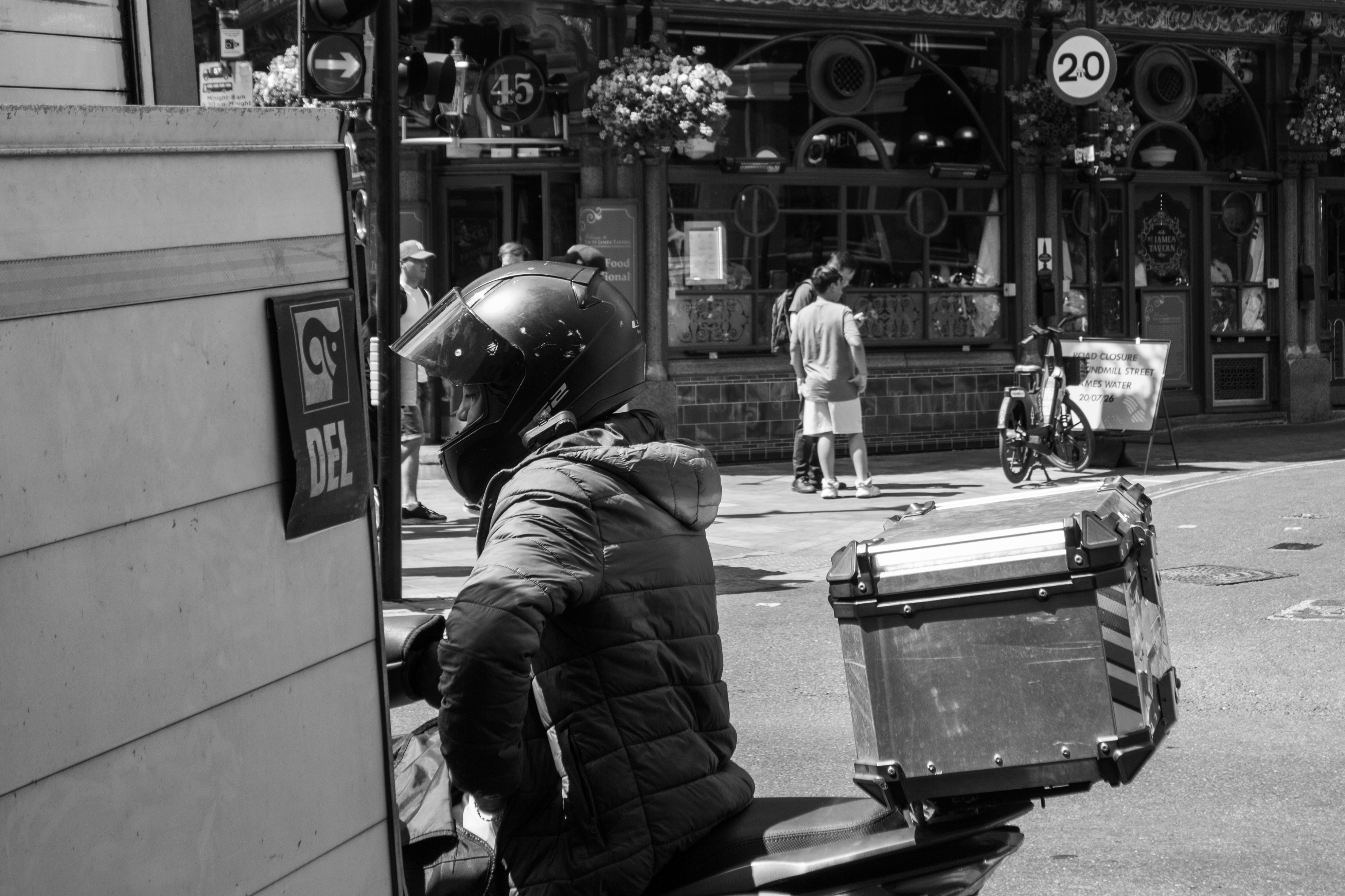 Front-Seat Rider and Delivery Scene in a Quiet City Street