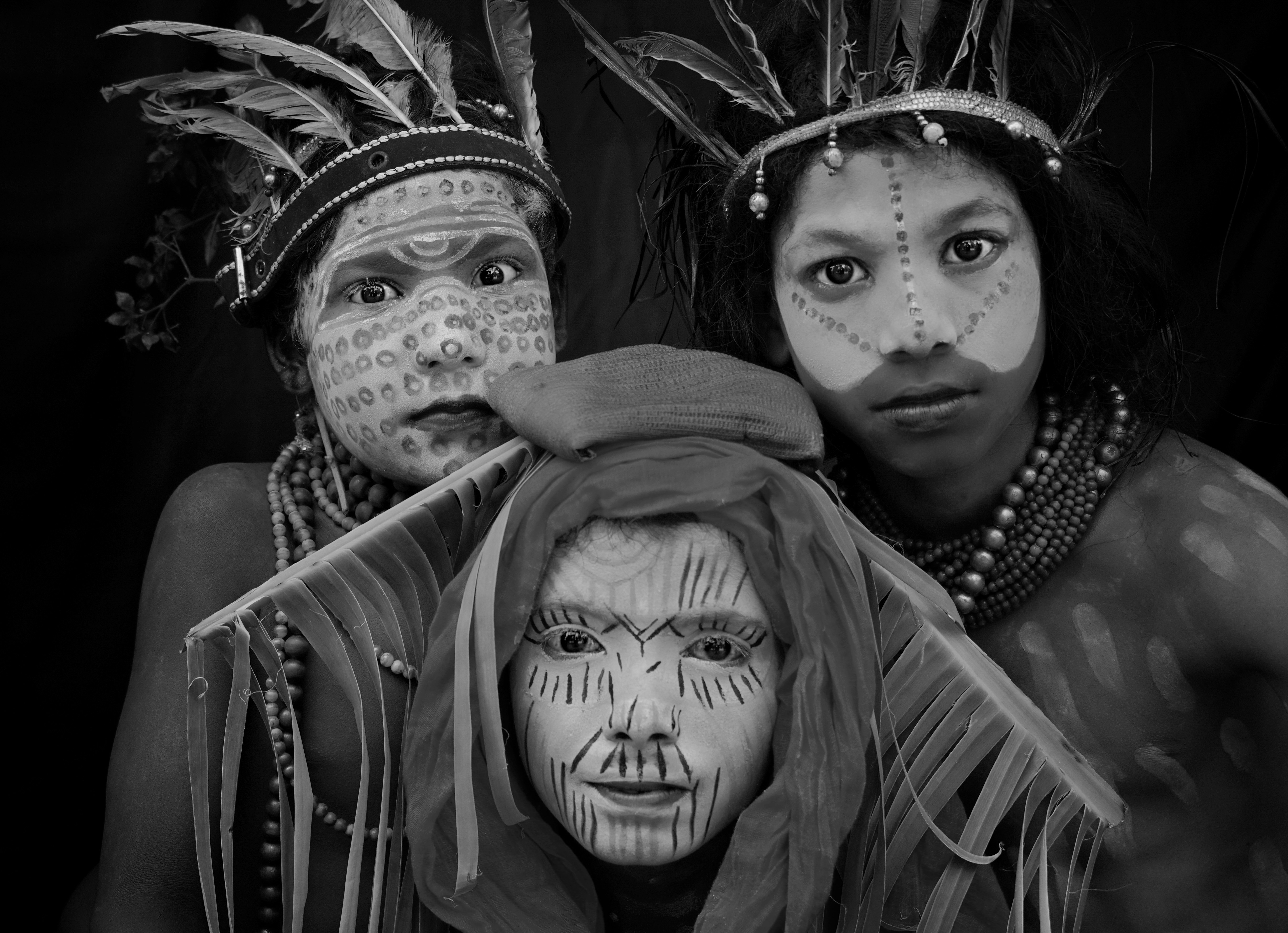 Faces in Veiled Mosaic: Tribal Masks Meet Veil of Mystery