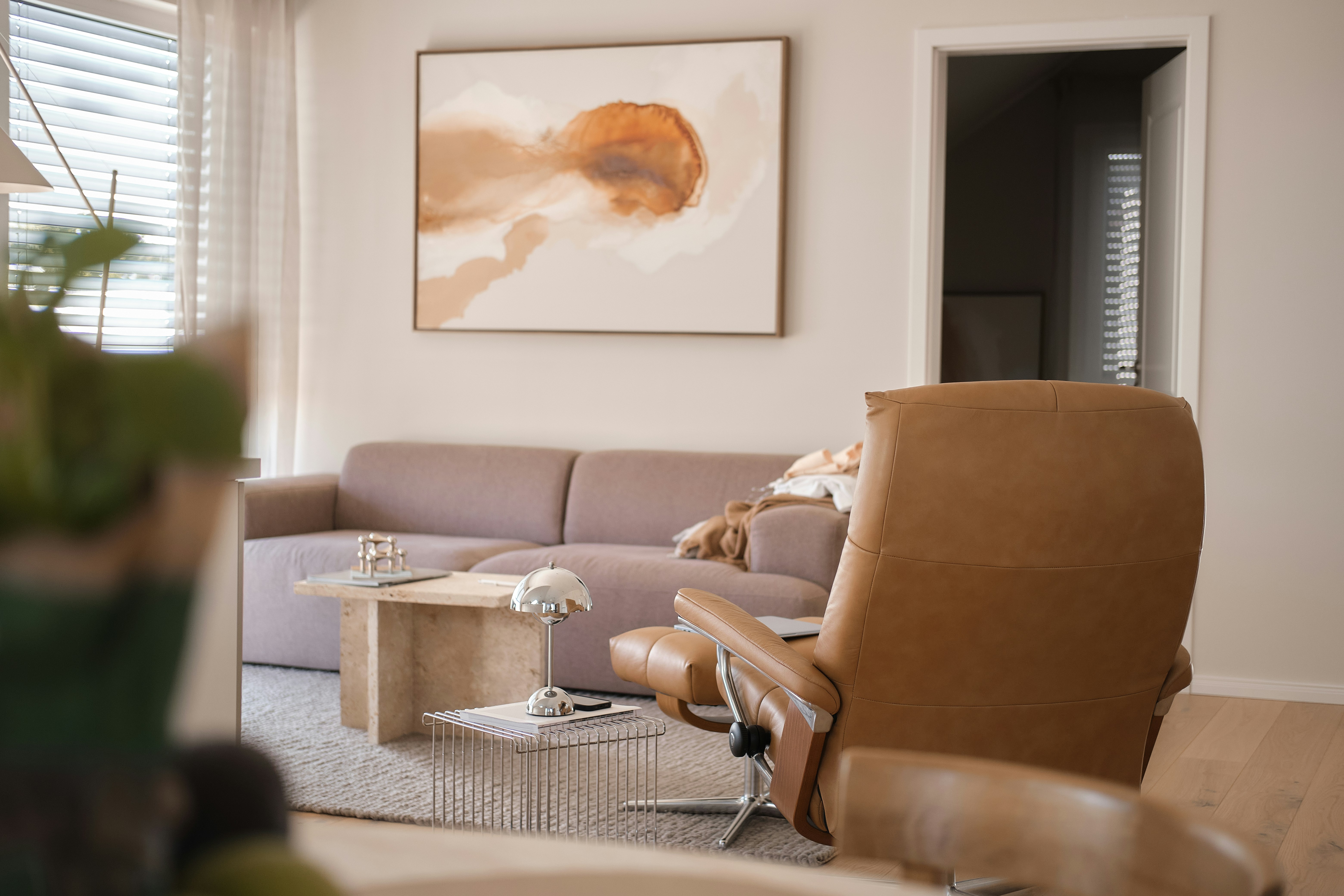Sunlit Living Room Nook with Leather Armchair and Lounge Sofa