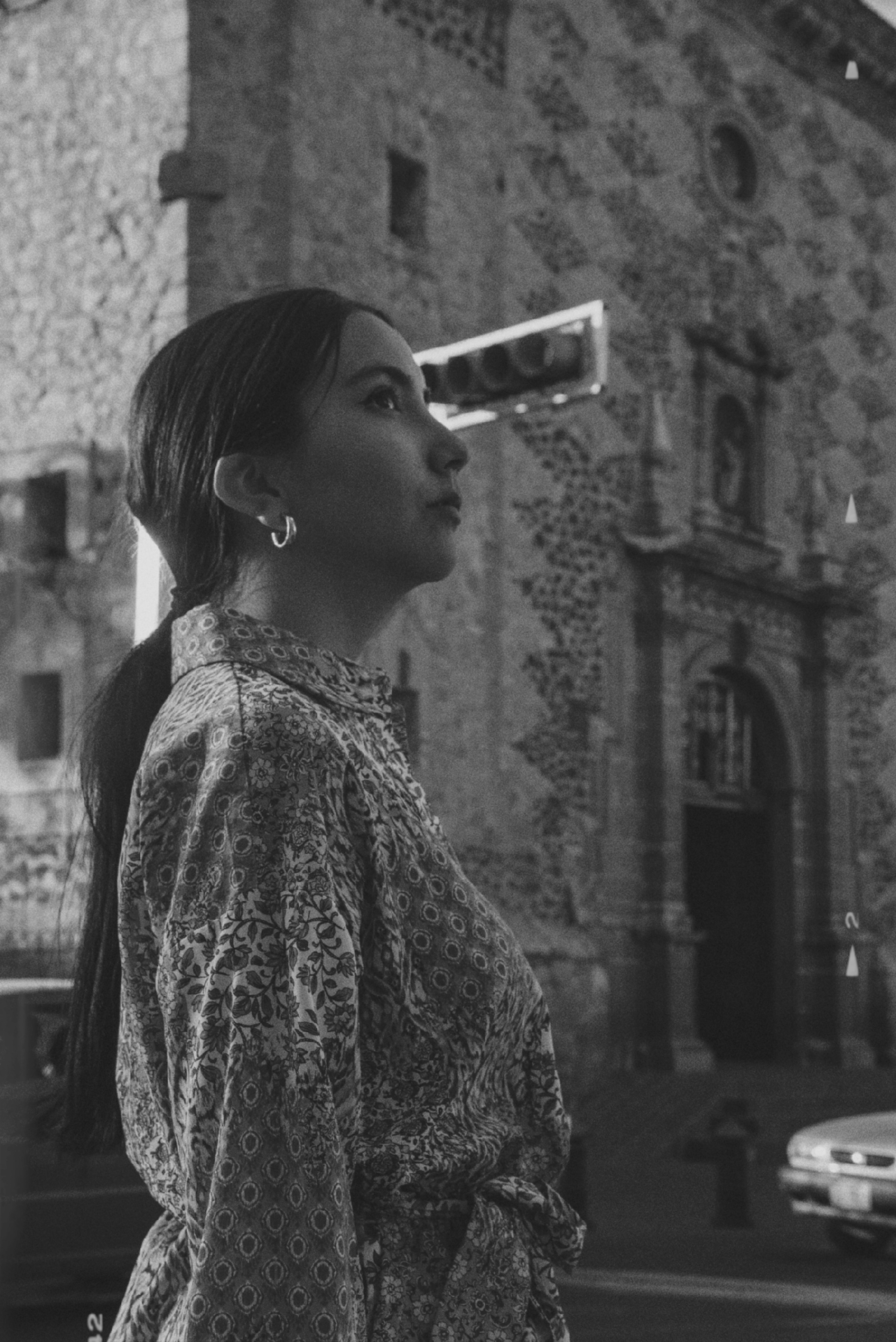 Profile in Stone: A Quiet Gaze Along a Historic Street