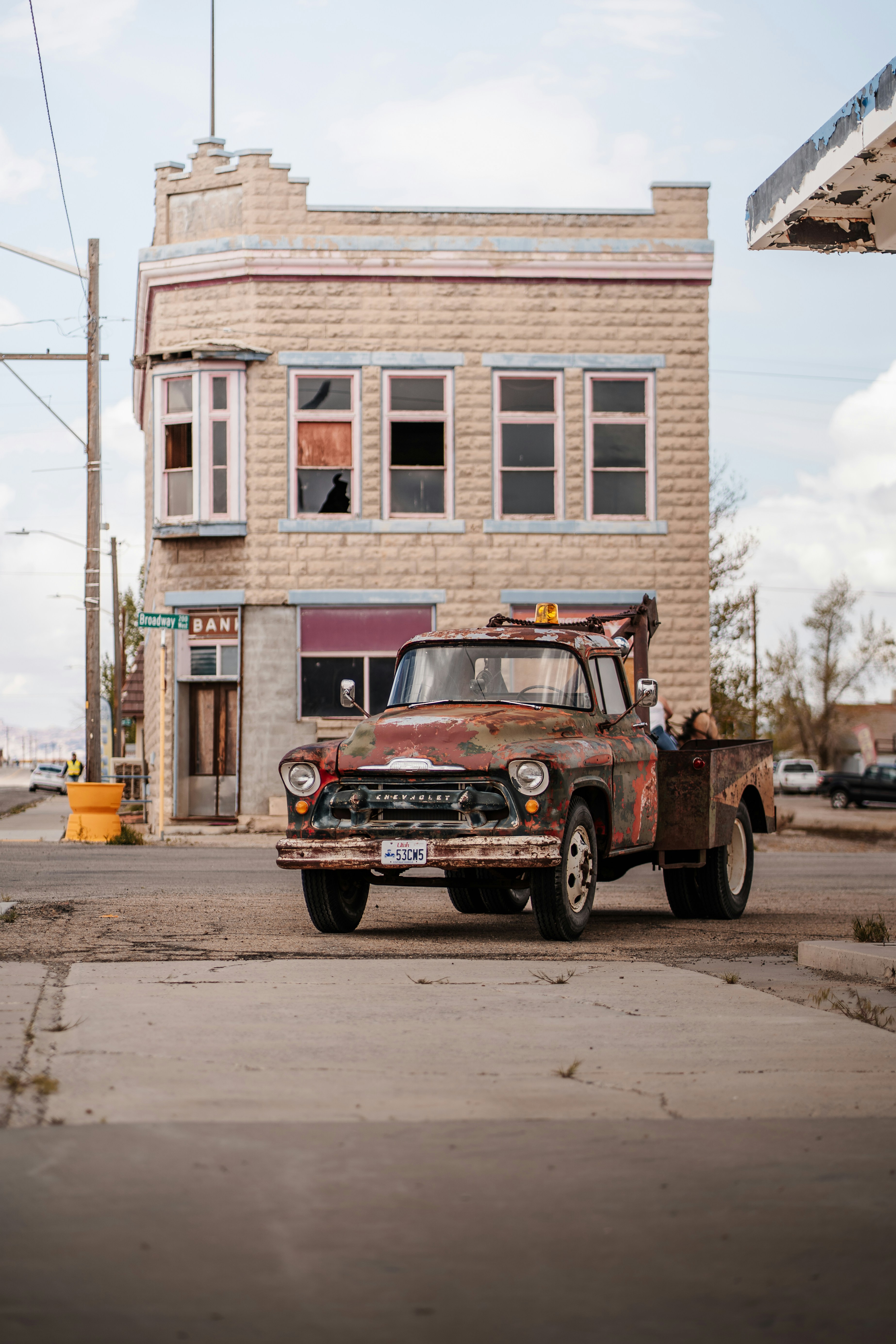 Rust and Route: A Weathered Pickup in a Desert Town