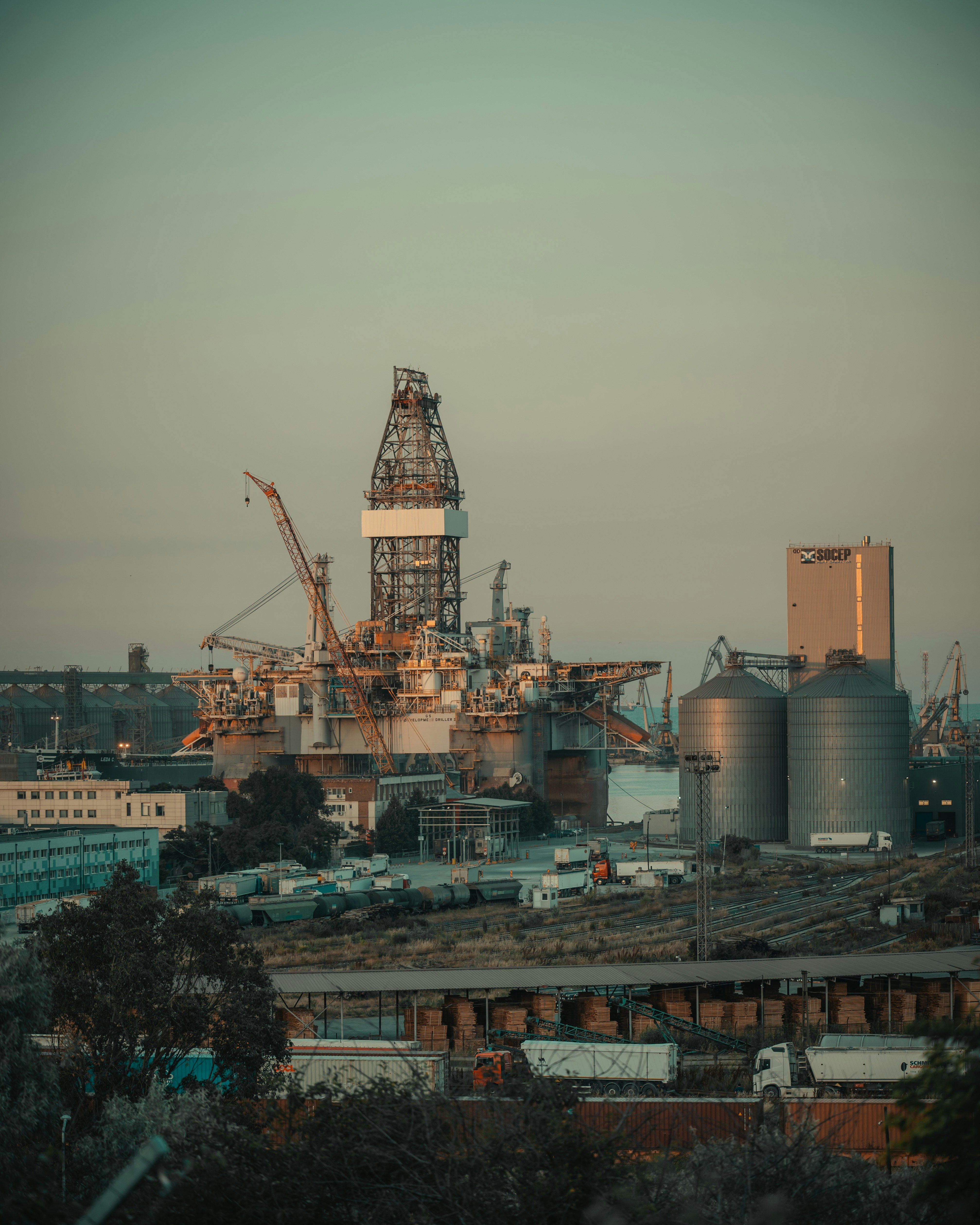 Industrial Skyline: Cranes and Silos Against a Quiet Horizon