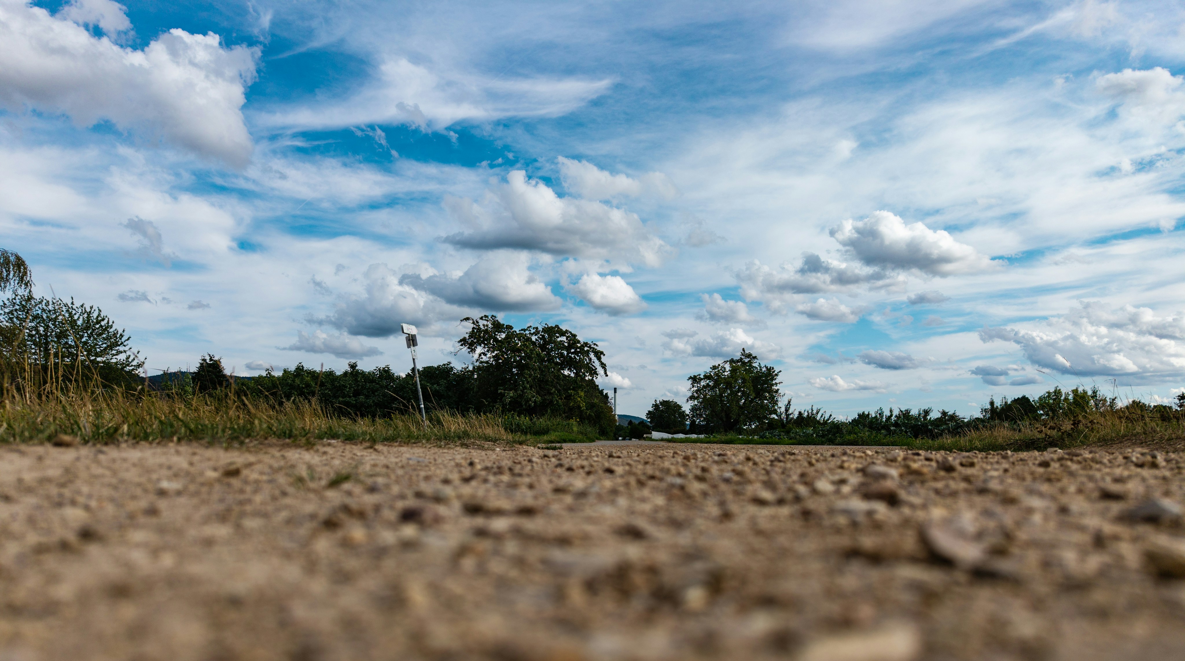 Low-Altitude Horizon: Quiet Road Under Expansive Sky