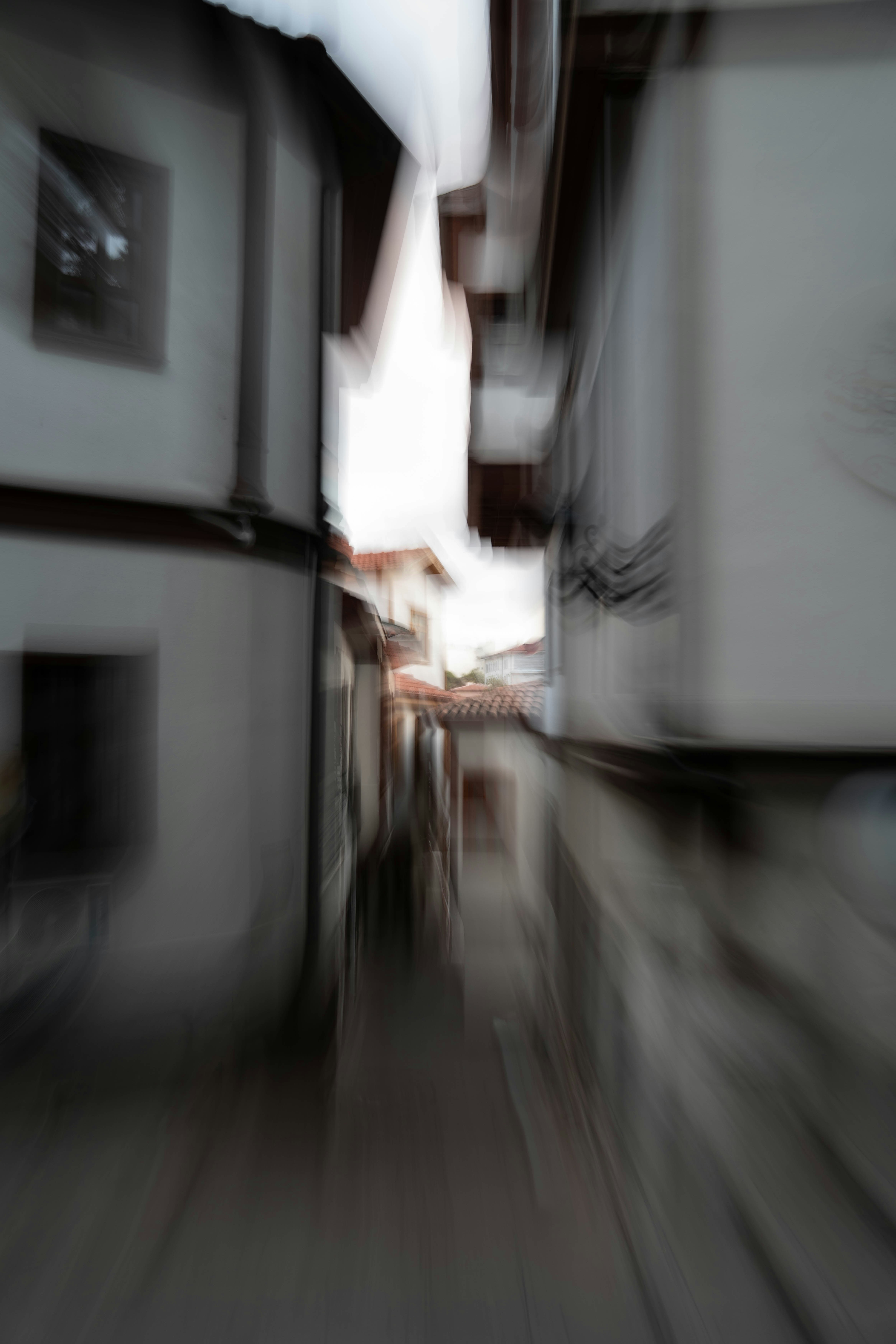 Blurred Alleyway Descent Toward Light