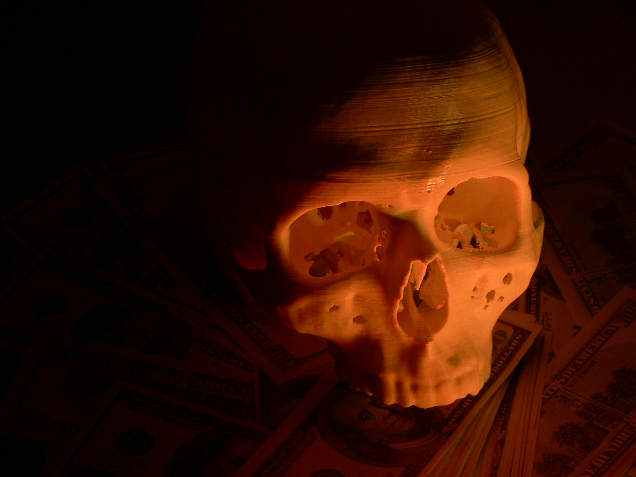 Inverted Illuminations: A Glowing Skull Resting on Currency