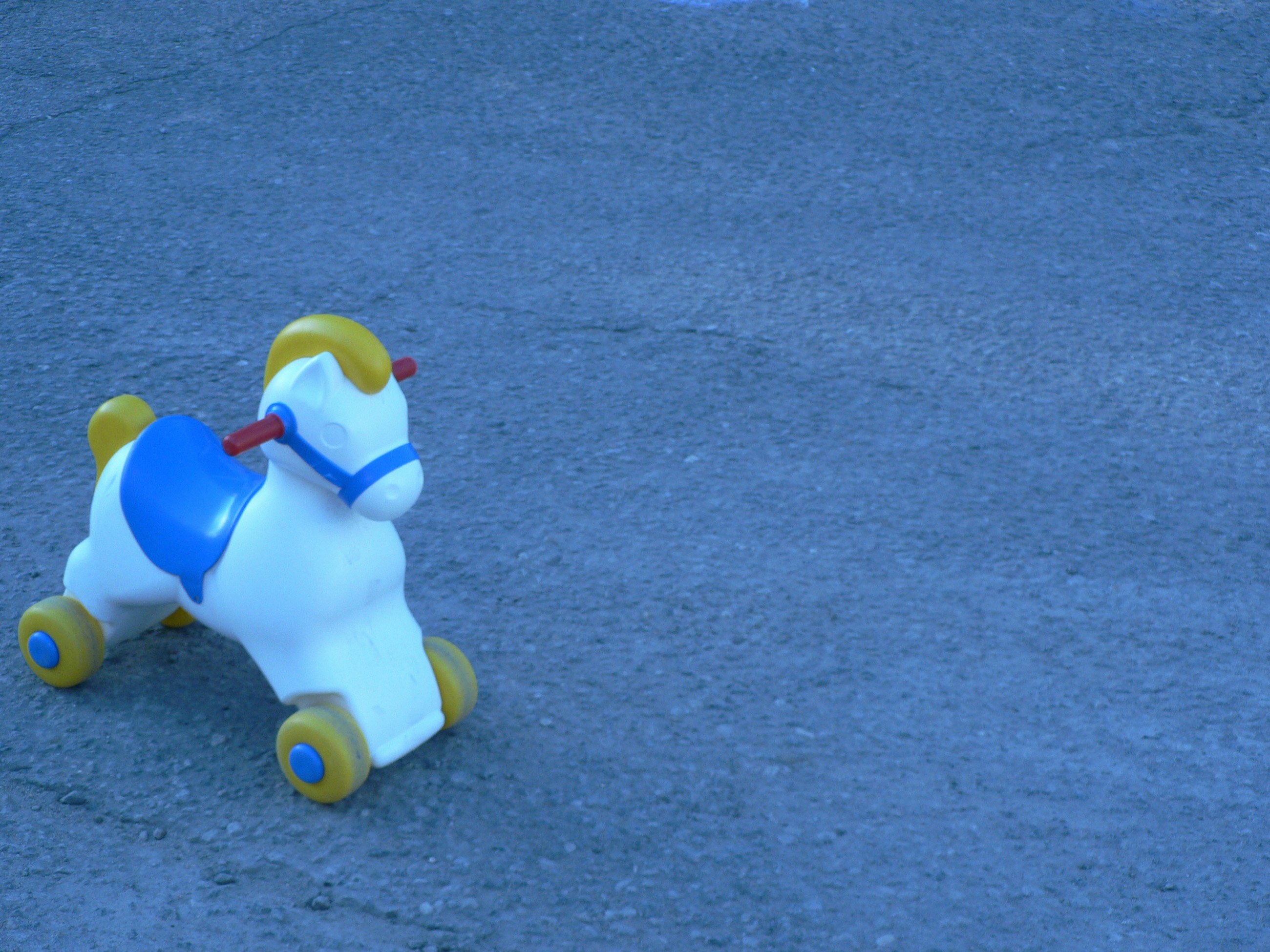 Tiny Roller Scooter on a Gray Road