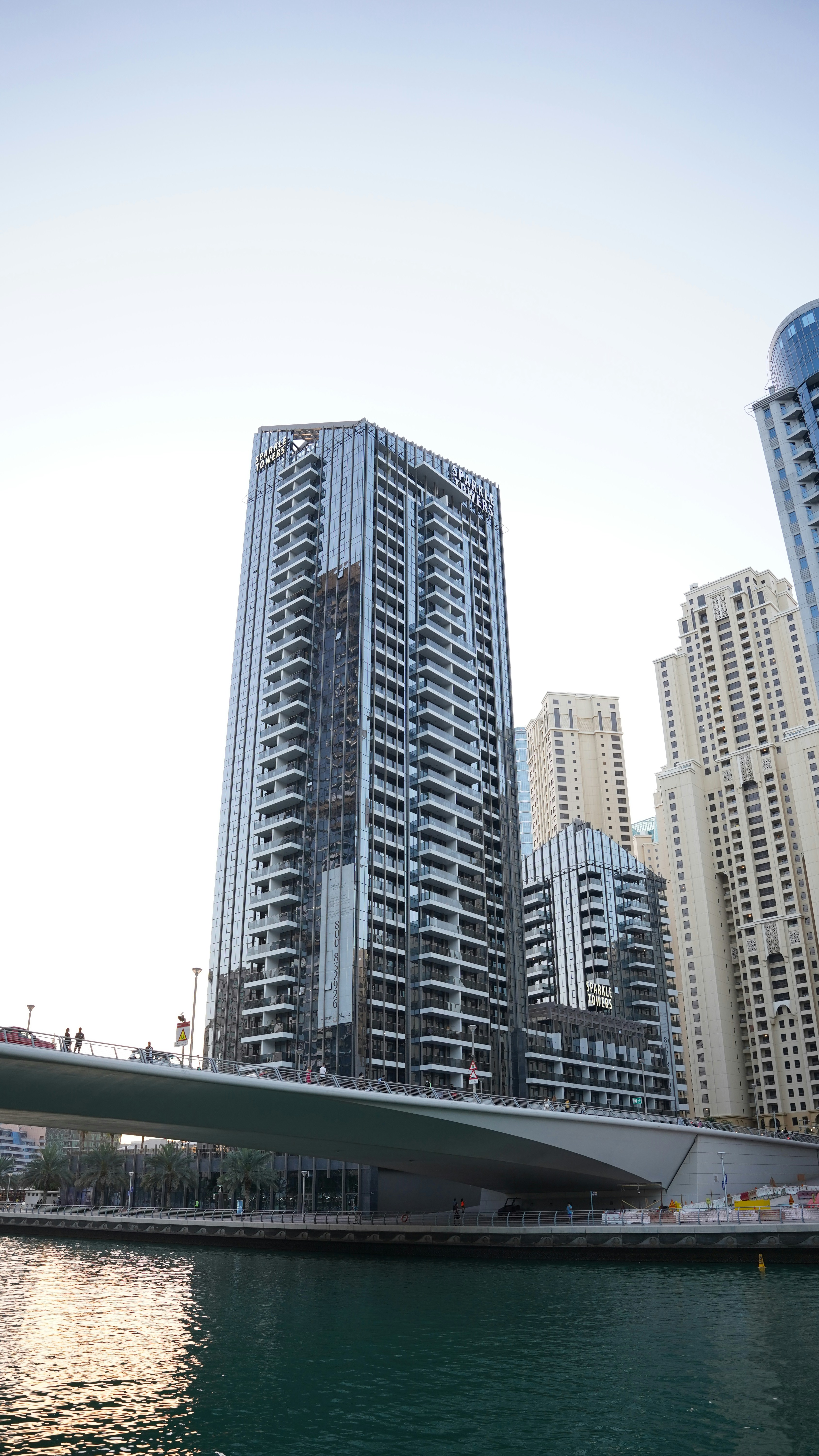 Azure Skyscrapers Afloat over Ribboned Bridge
