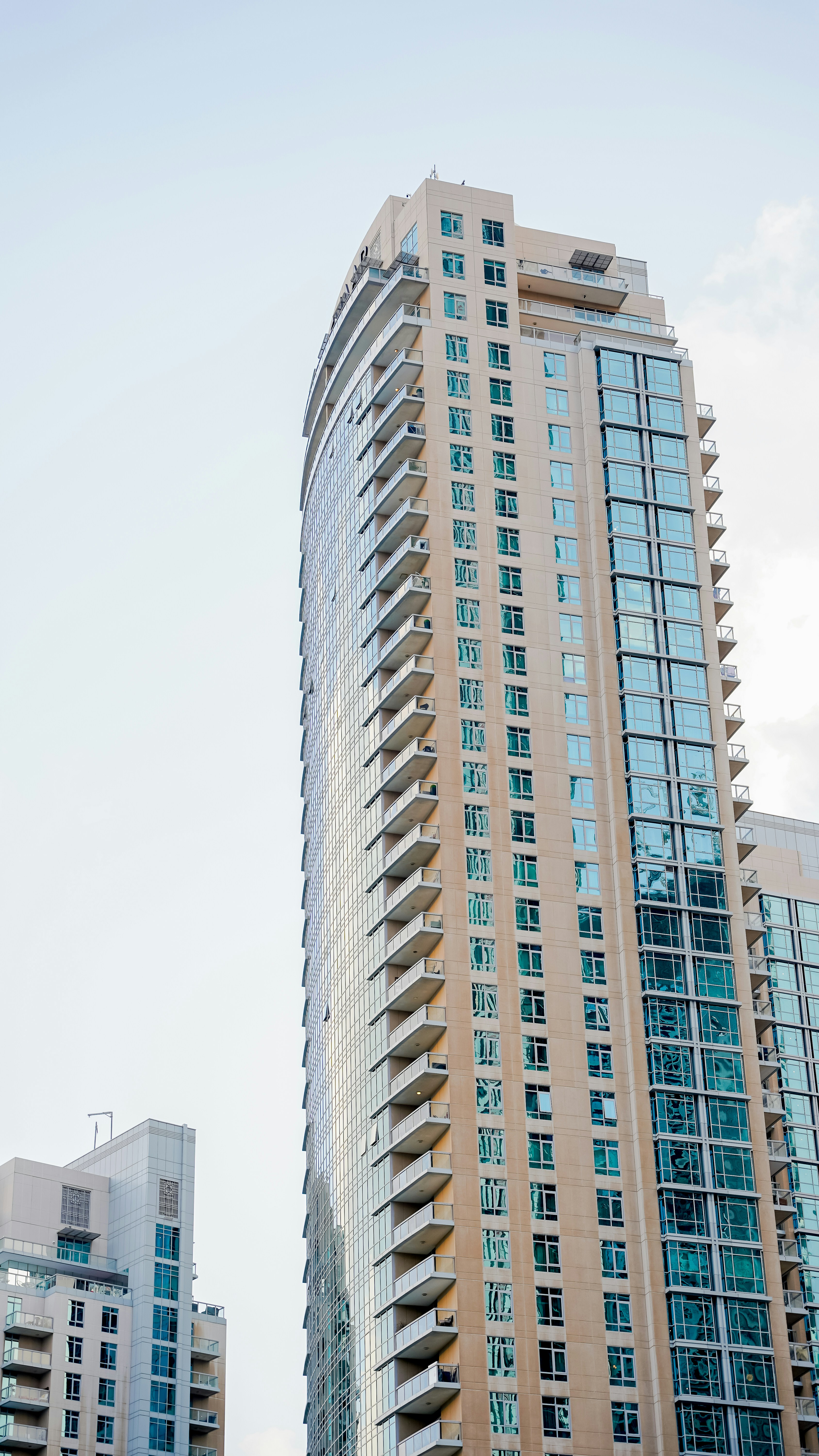 Skyward Terrace: A Towering Curve of Glass and Concrete