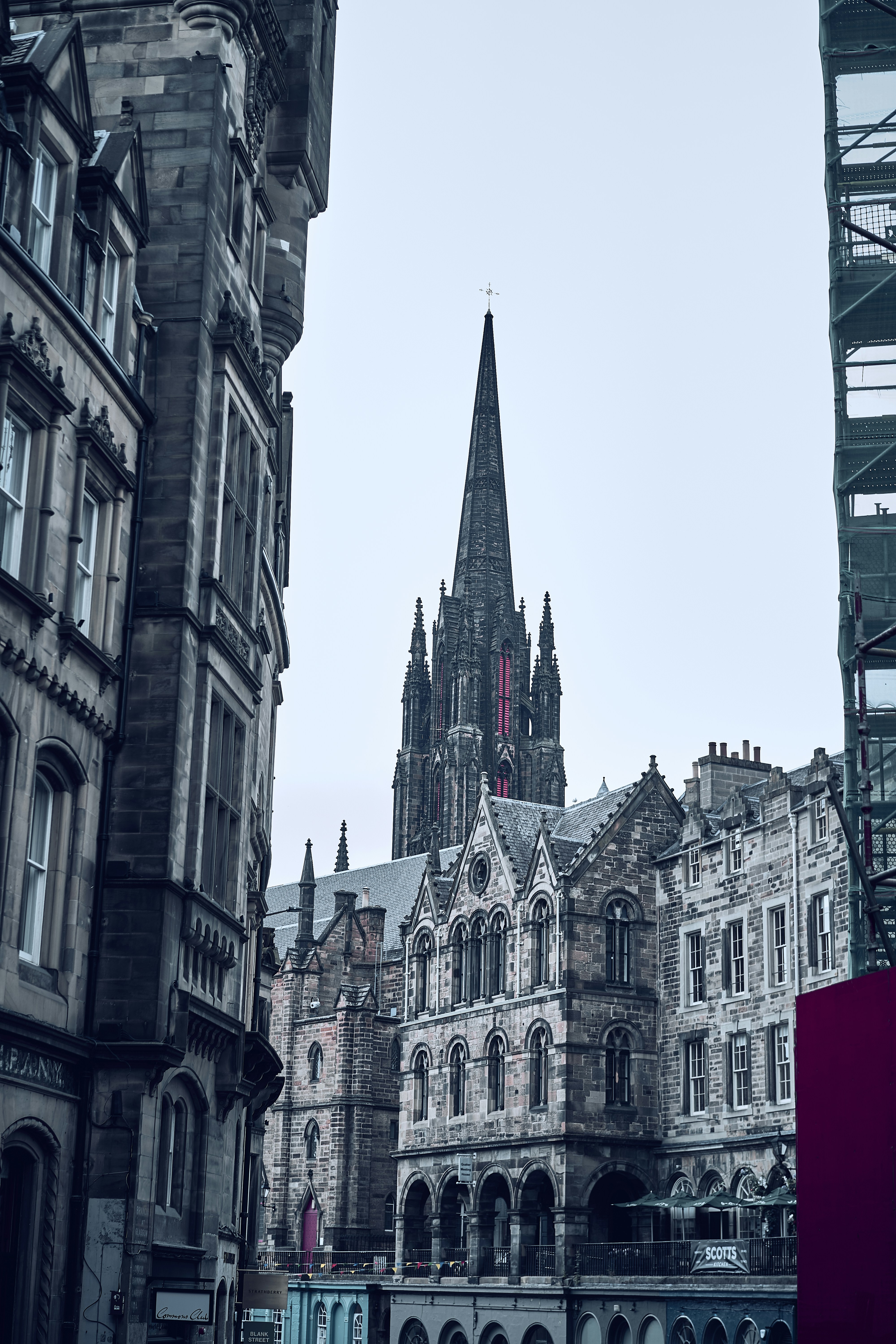 Gothic Spire Between City Facades