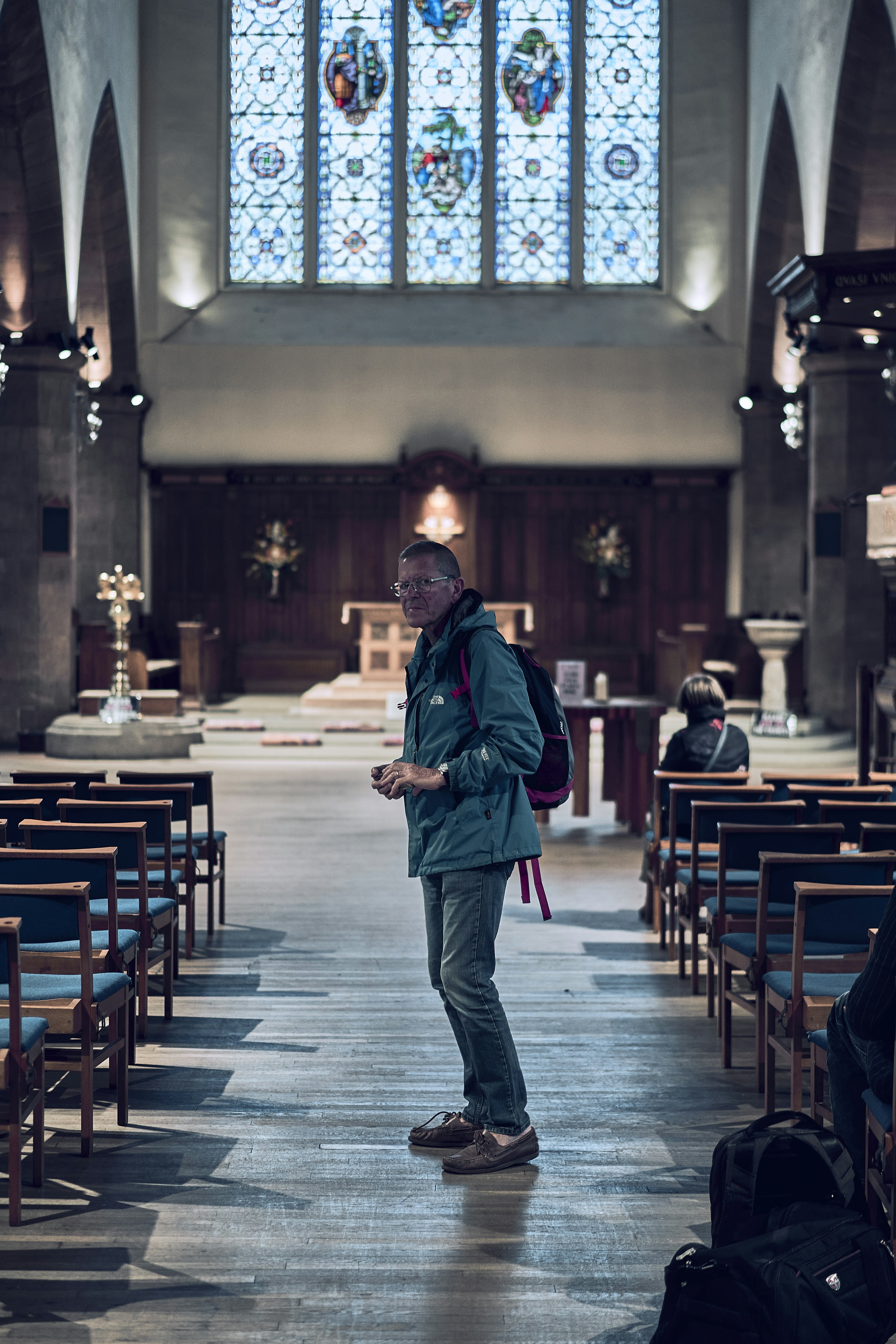 Traveler in a Sacred Hall: Quiet Confidence Under Stained Glass