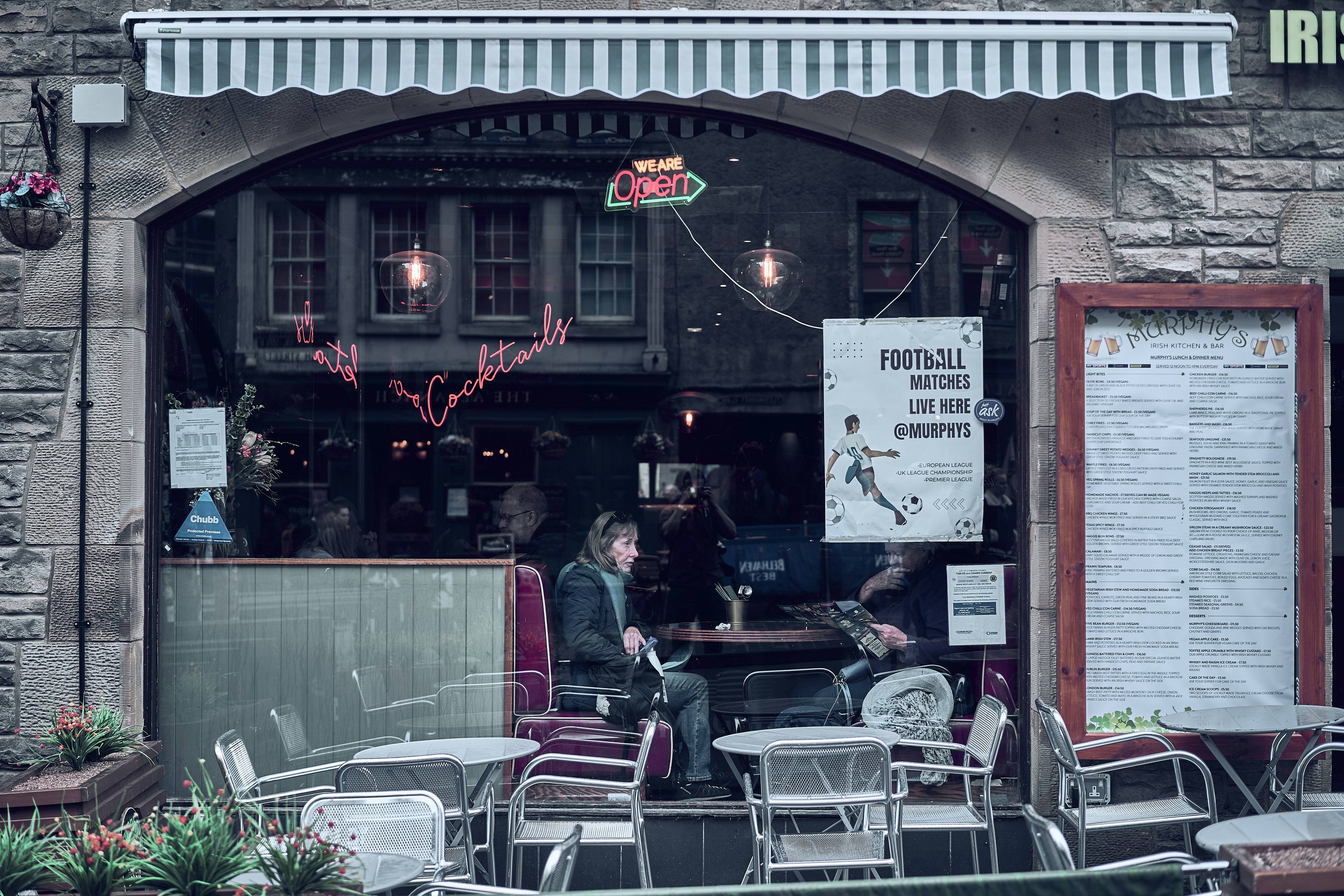 Quiet Corner Café: Neon Signage and Outdoor Seating