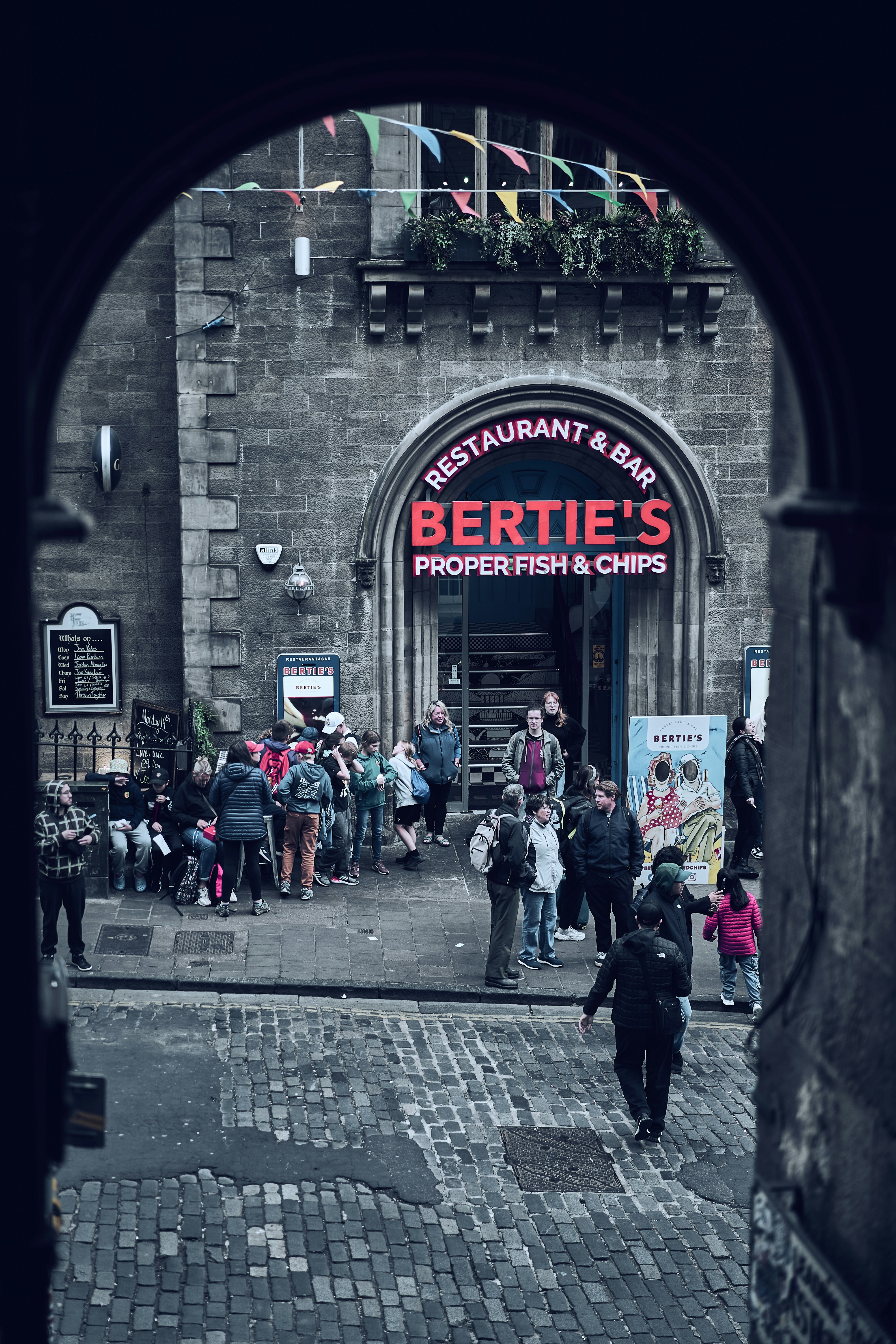 Bertie’s Neon Signway: A Crowd Gathers at a Historic Archway