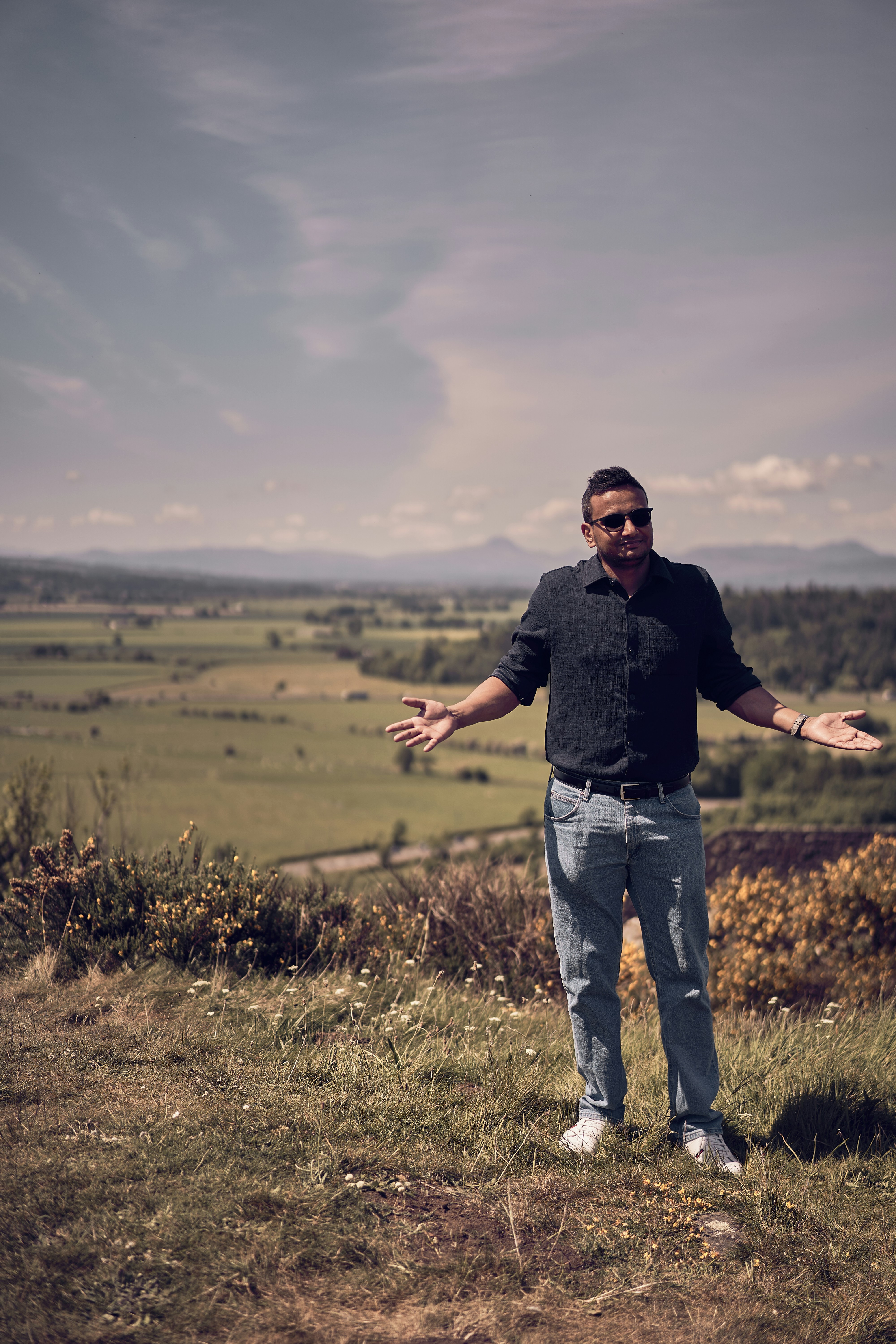 Outstretched in the Valleys: A Confident Presence Against Rolling Fields