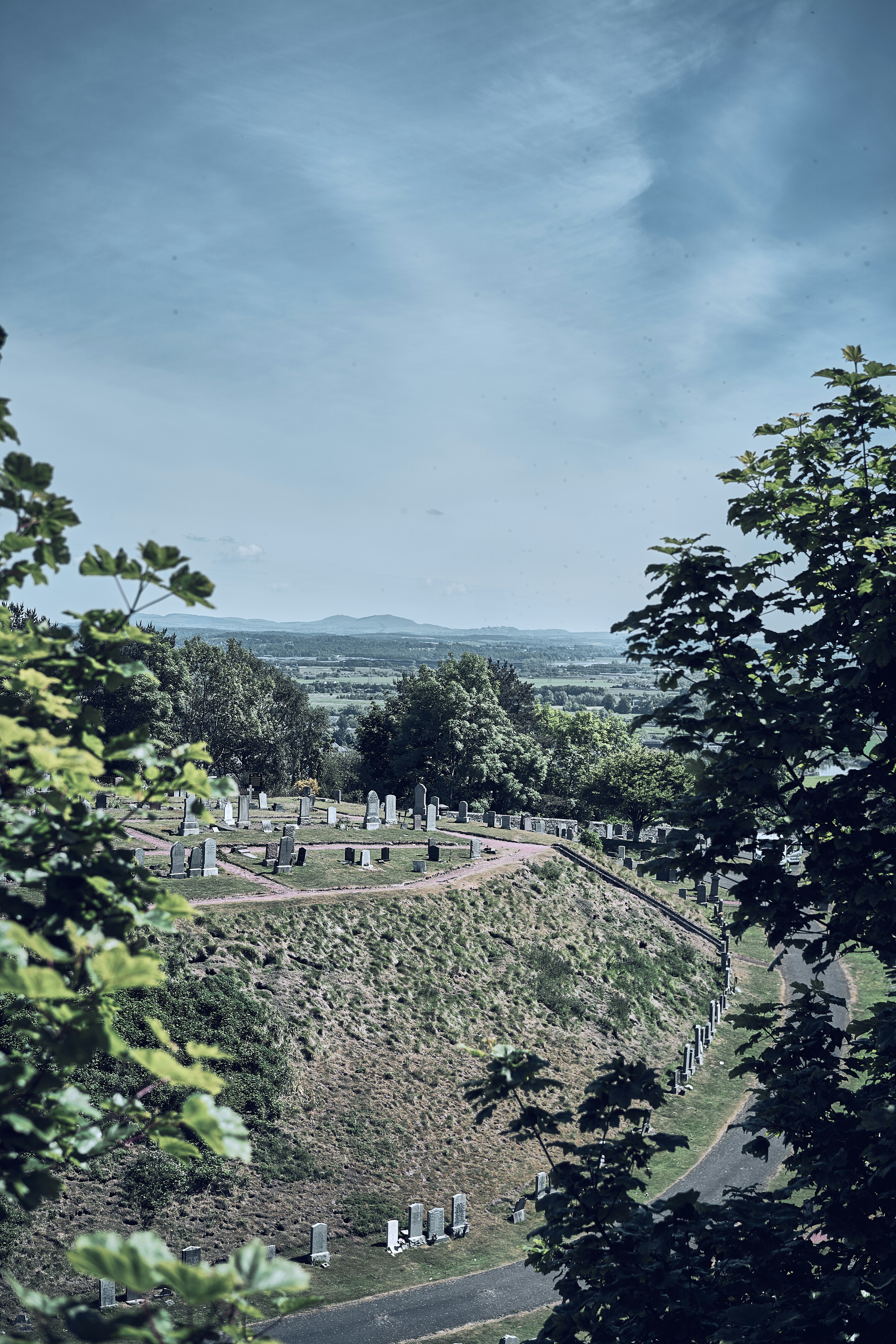 Ridge Tombstones Overlooking a Quiet Valley