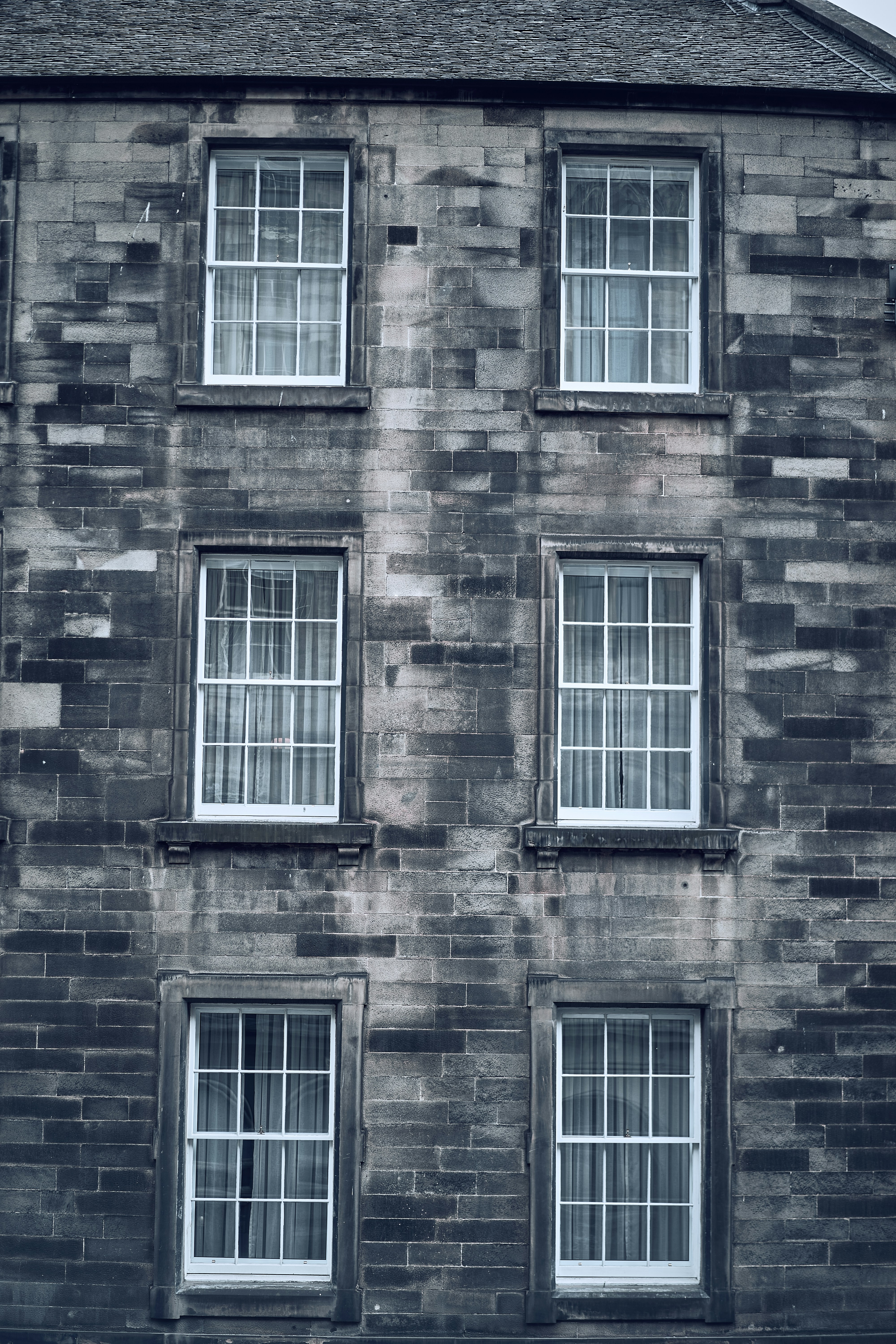 Symmetrical Stone Facade with Six Windows