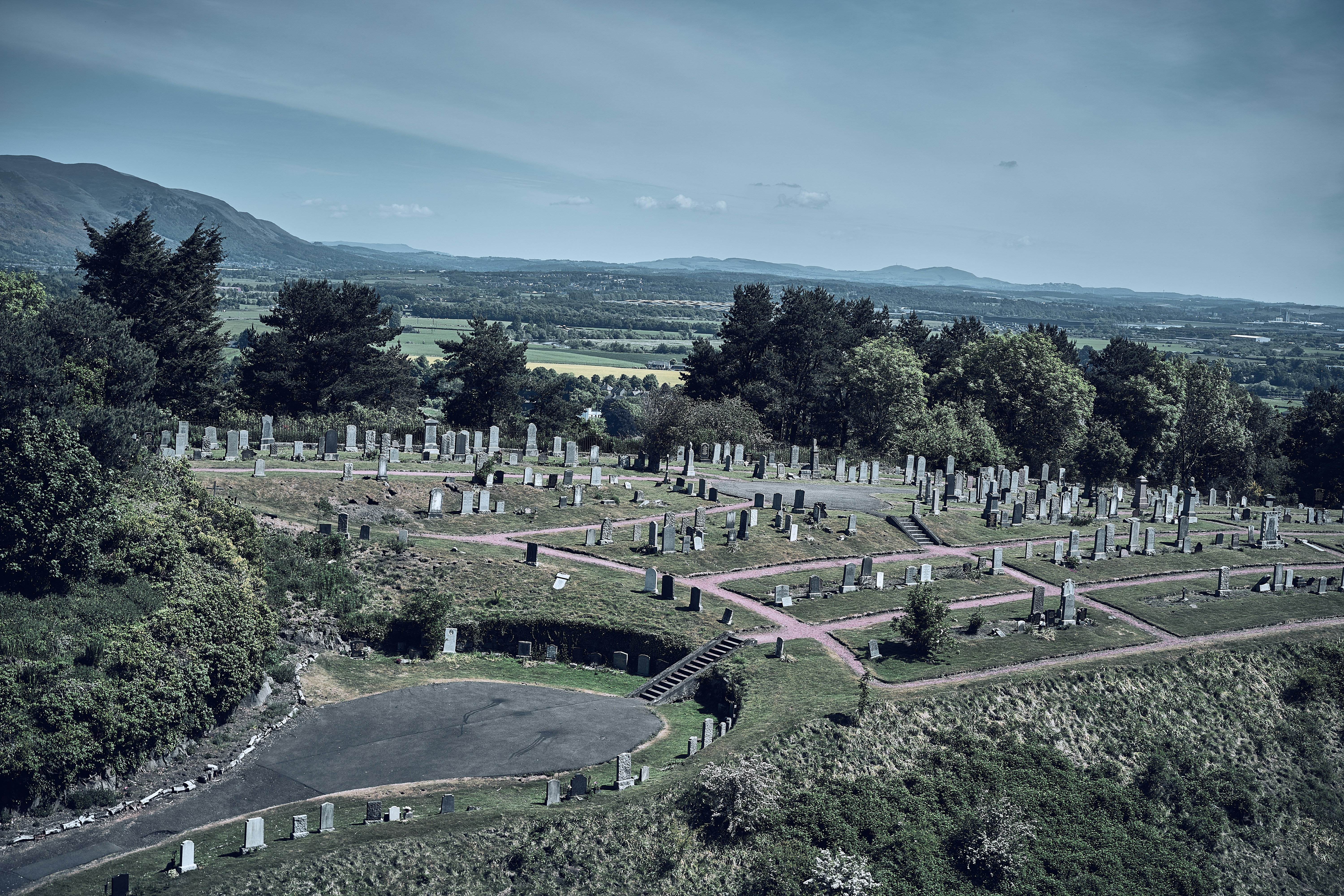 Cemetery Aerial: Lines of Memory Across Rolling Hills