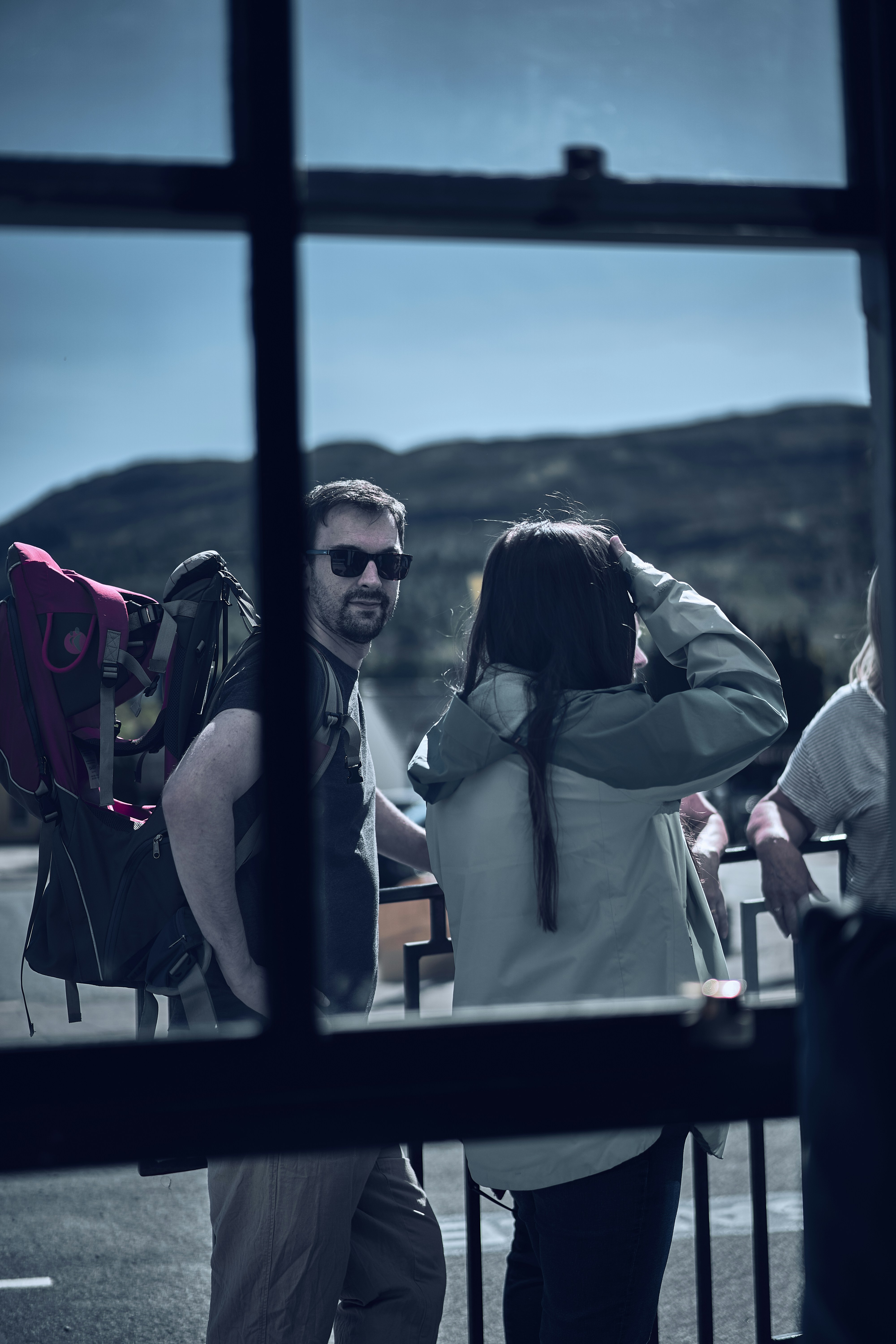 Hikers by the Window: A Quiet Pause on the Trail