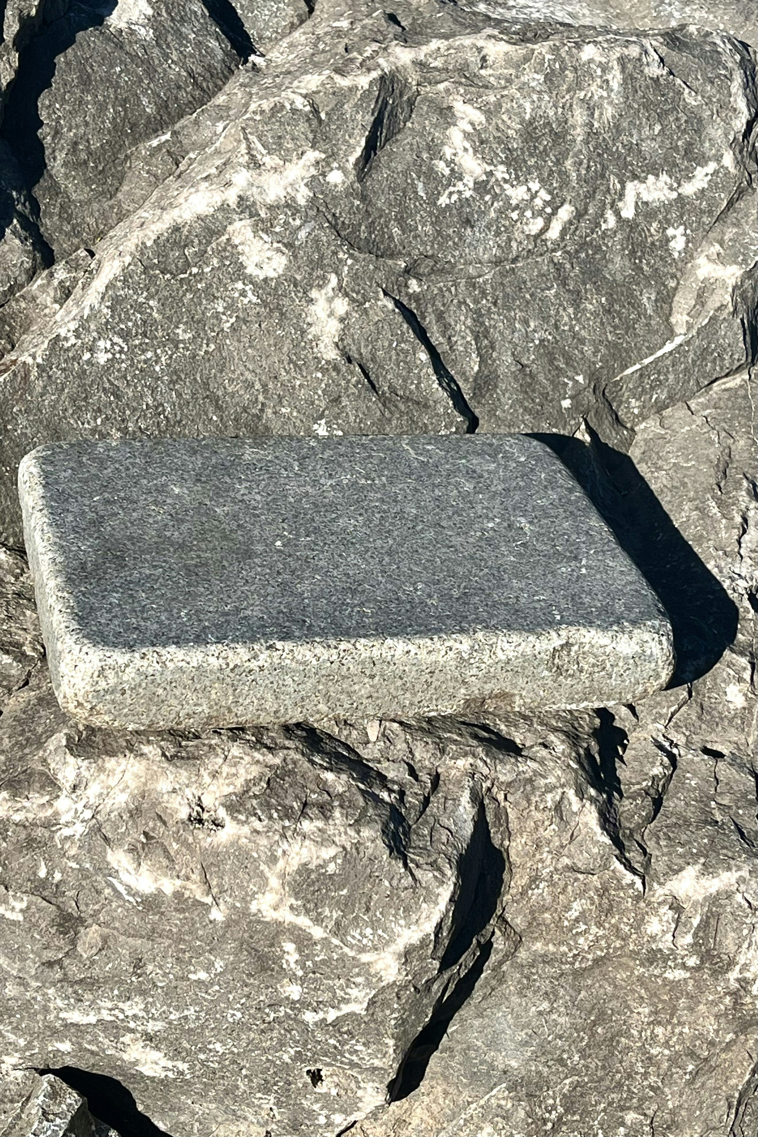 Stone Bench on a Jagged Rock Slope