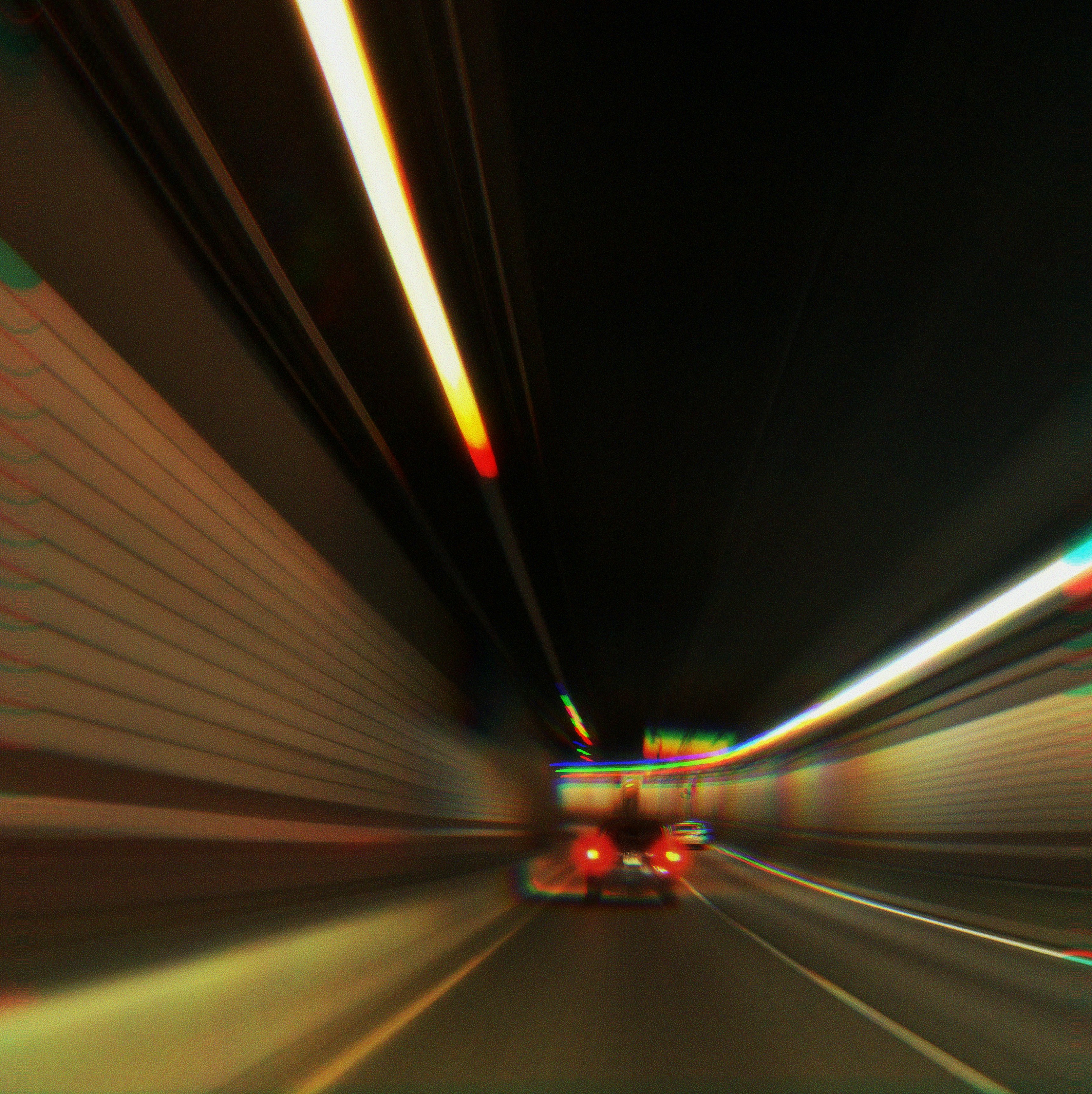 Motion Through the Tunnel: Neon Streaks and End Lights