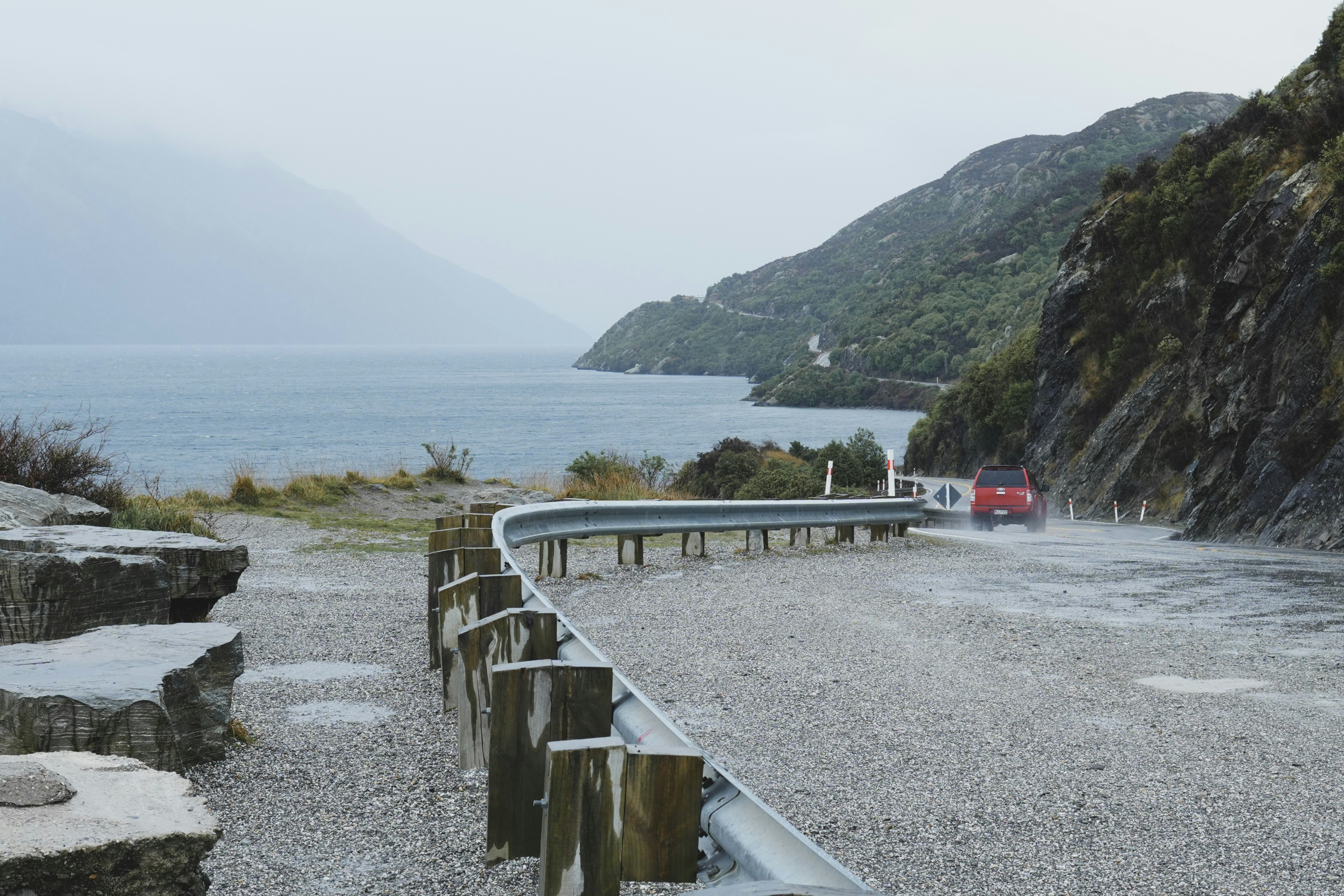 A Serene Coastal Drive Bends Between Sea and Cliff