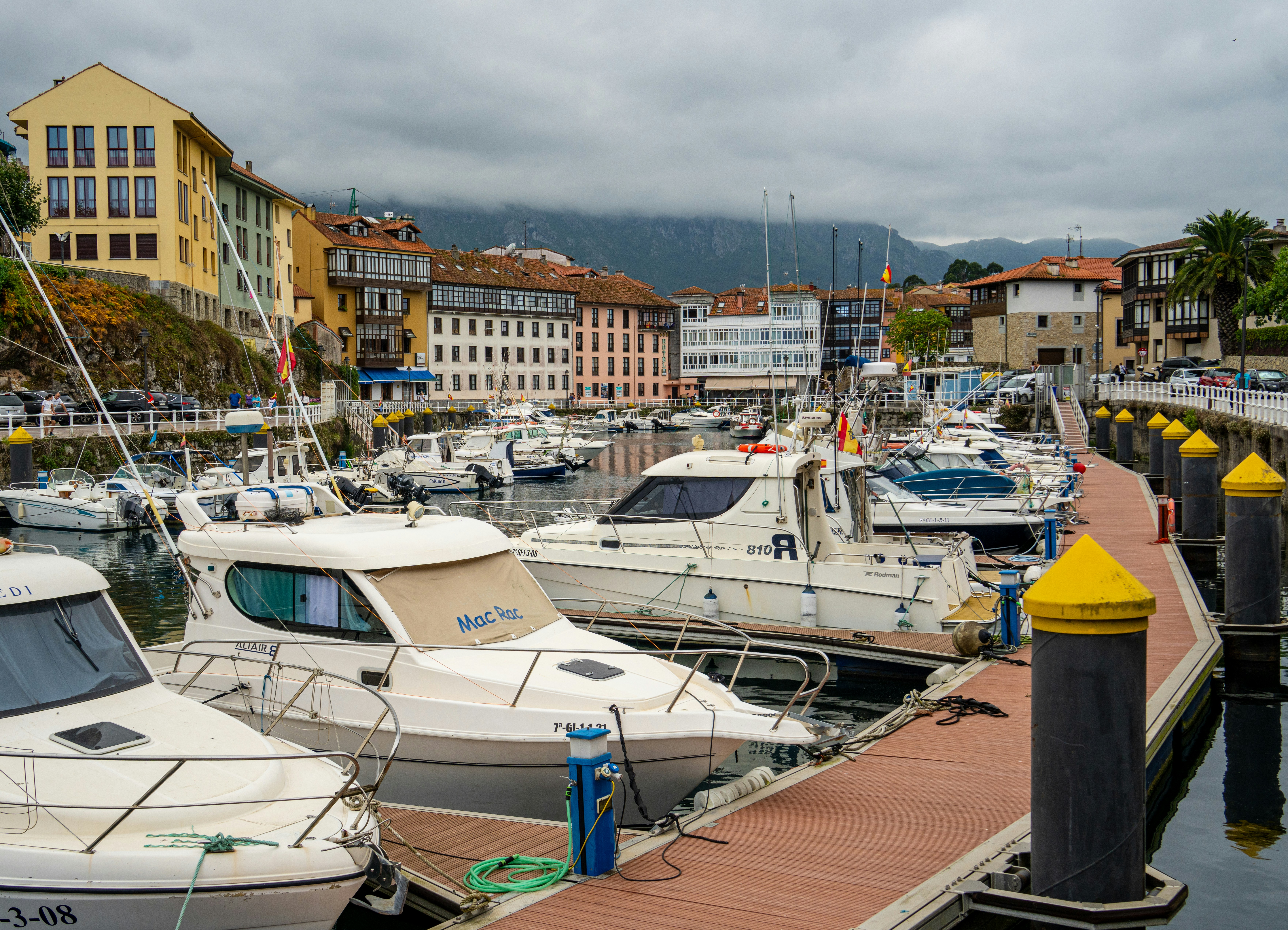 Dockside Gallery: Boats Resting Along a Colorful European Marina