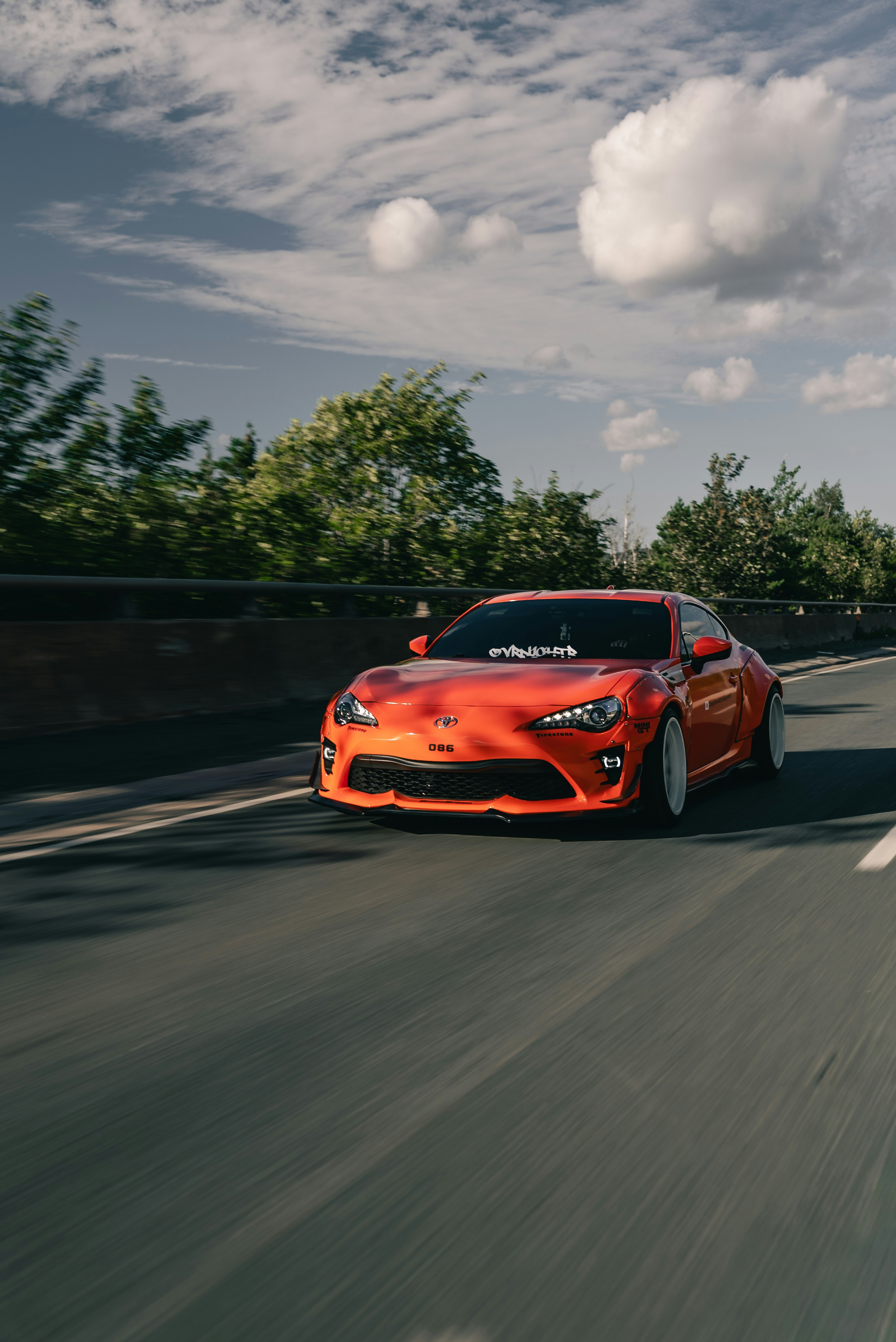 Red Lightning: A Convertible on a Winding Highway