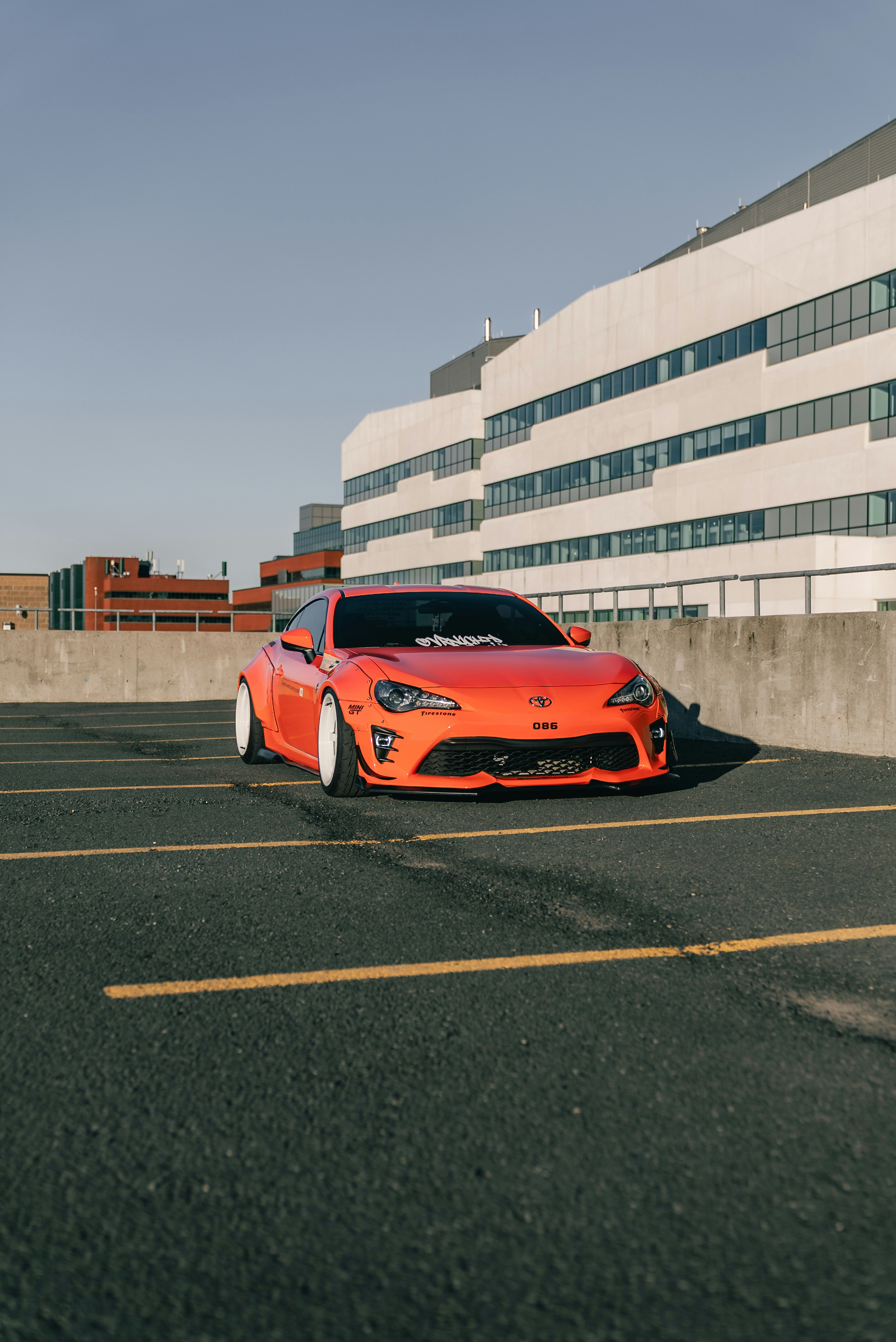 Orange Chevy Stance: a sunlit rooftop centerpiece