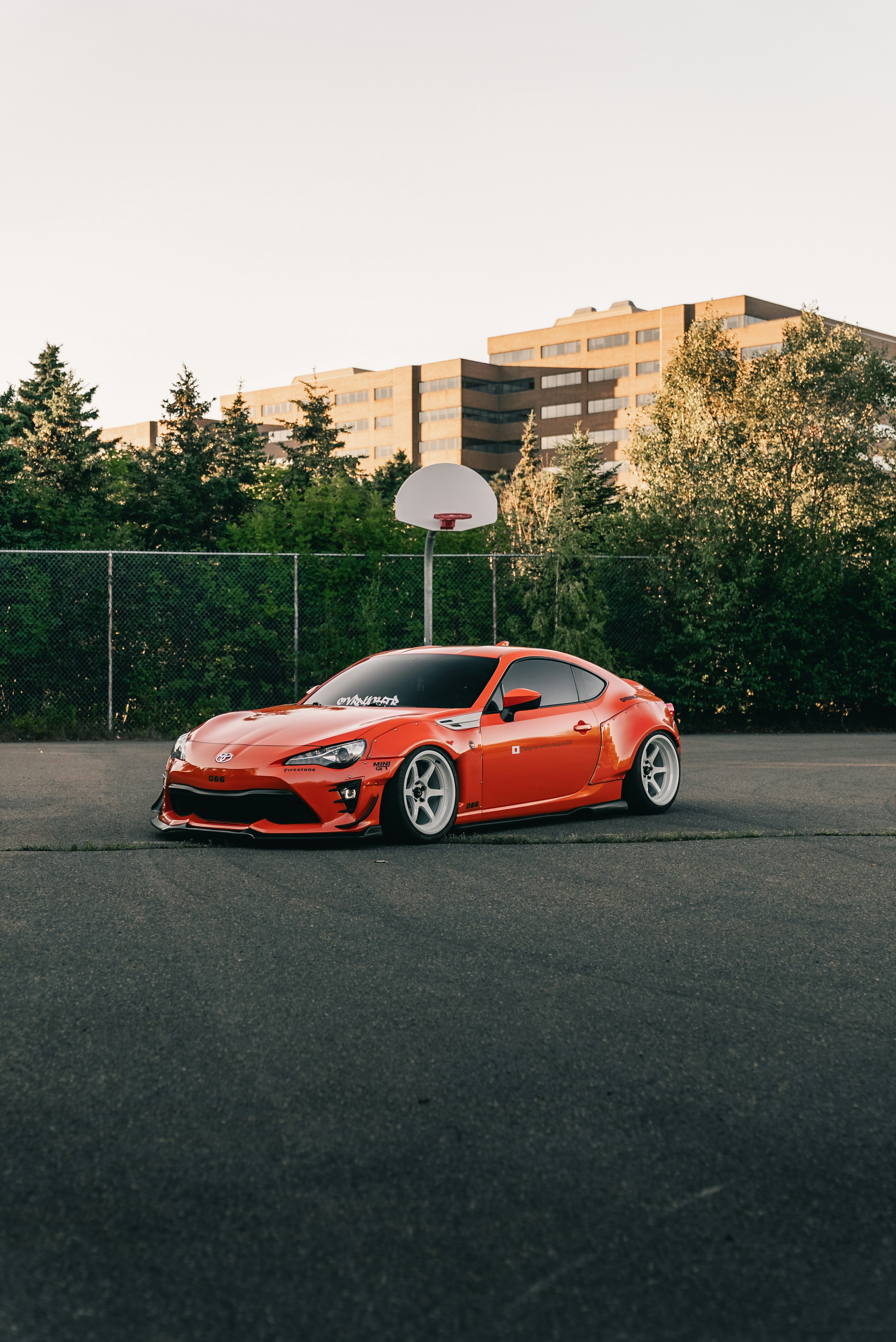 Crimson Stance: A Low-Slung Prelude to Sunset Asphalt