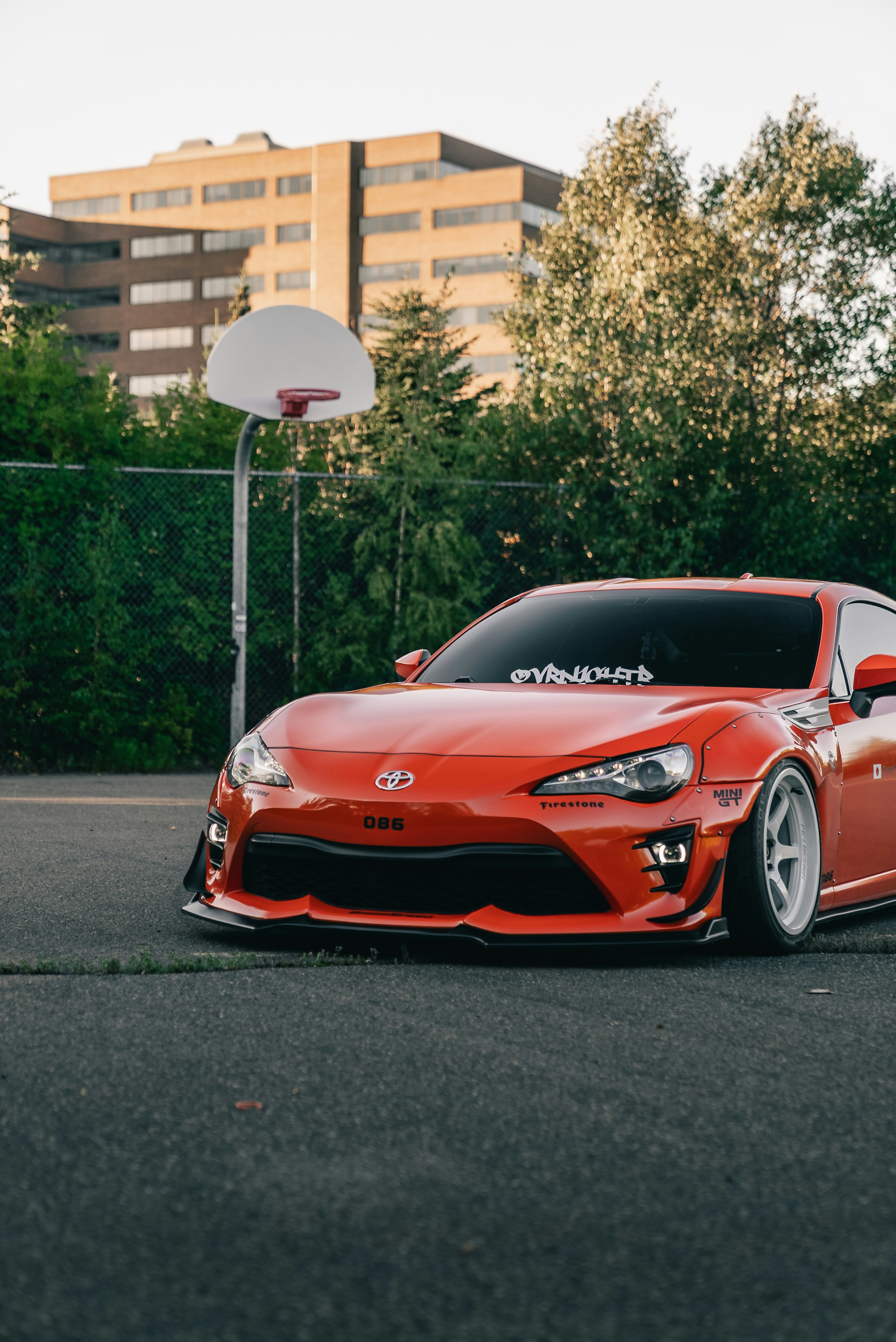 Red Velocity: A Low-Angle Look at a Stanced Civic on a Quiet Court