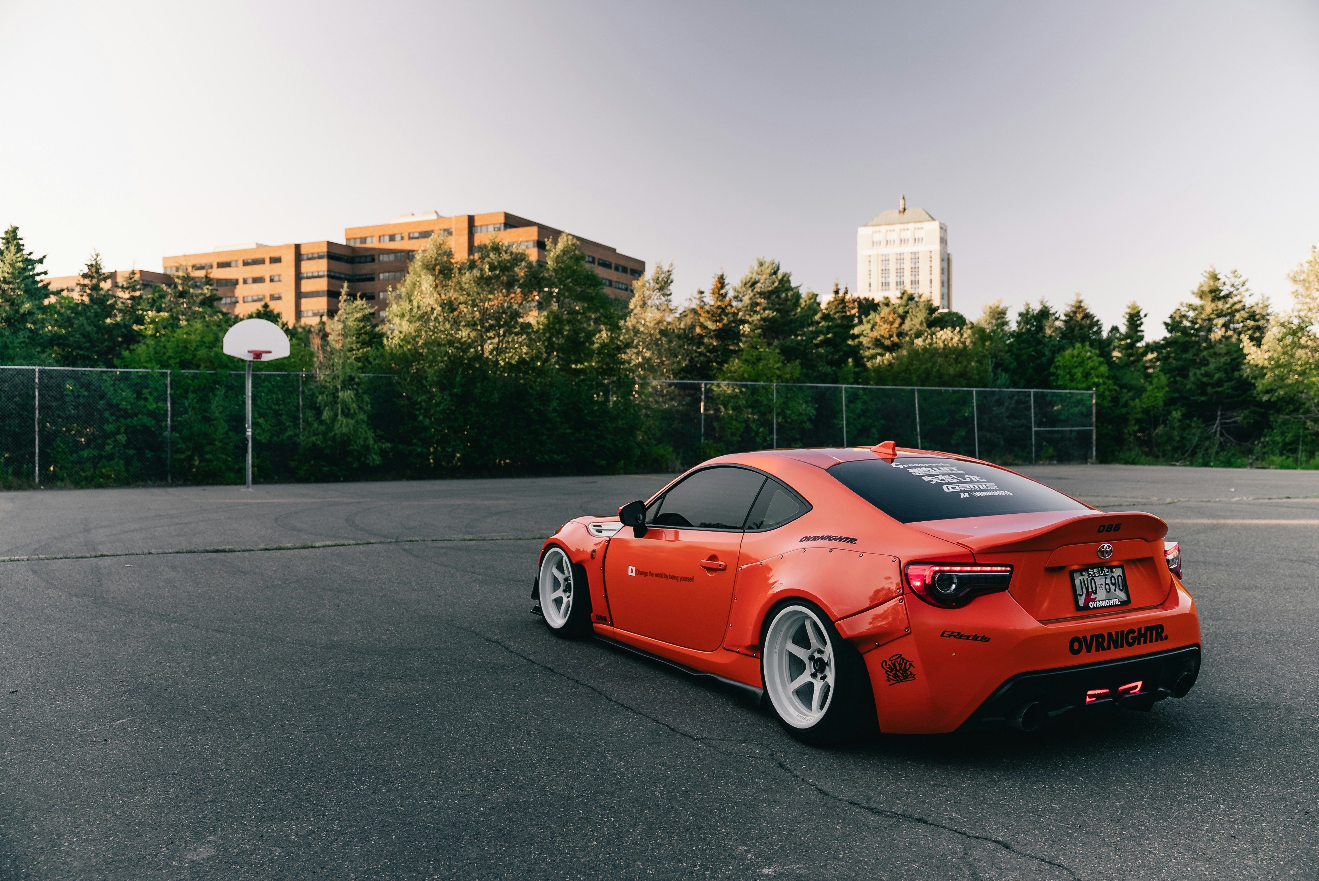Low-angle Red: A Customized GT Stands in an Empty Lot