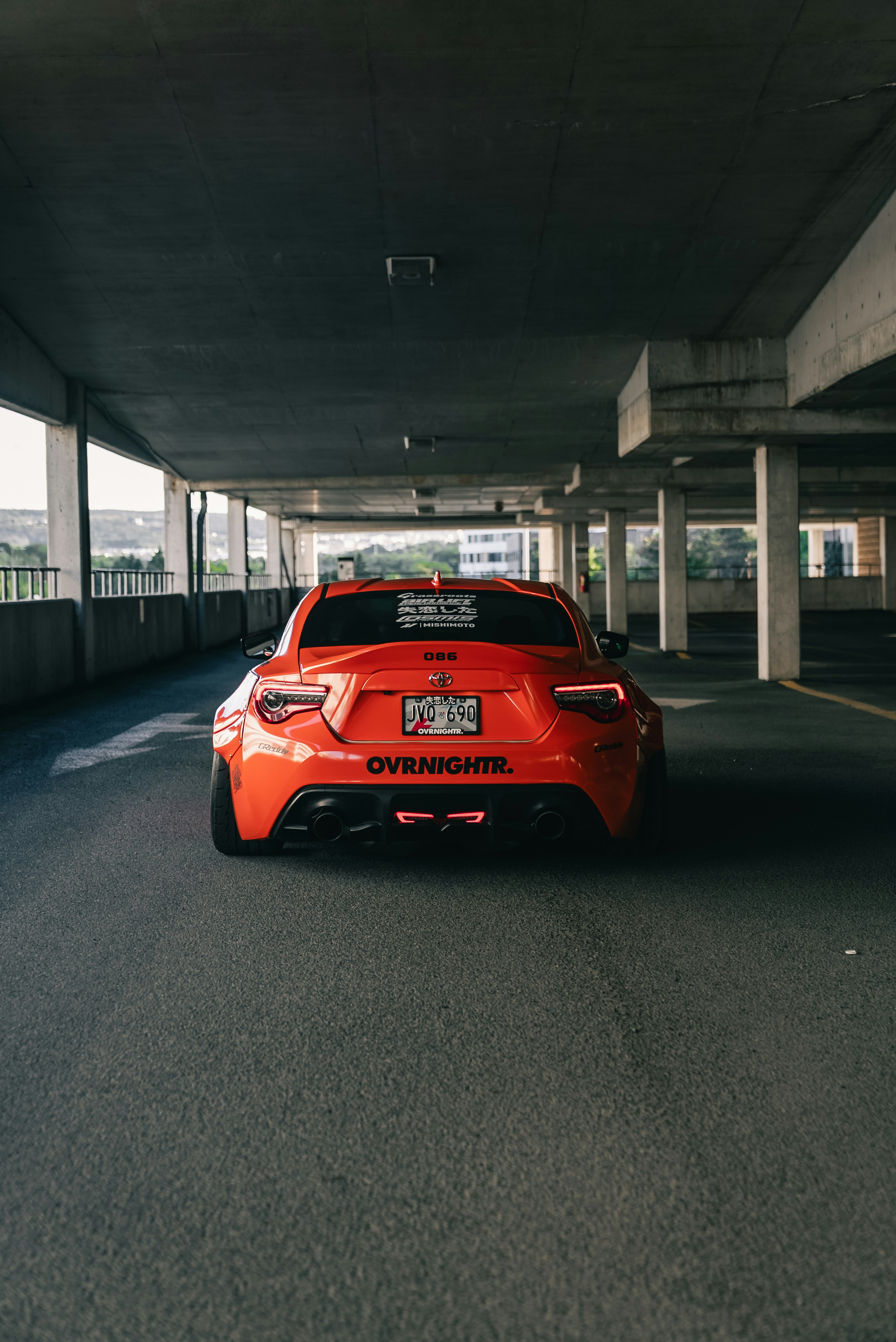 Orange Drifter: Parking Lot Racer Under Concrete Skies