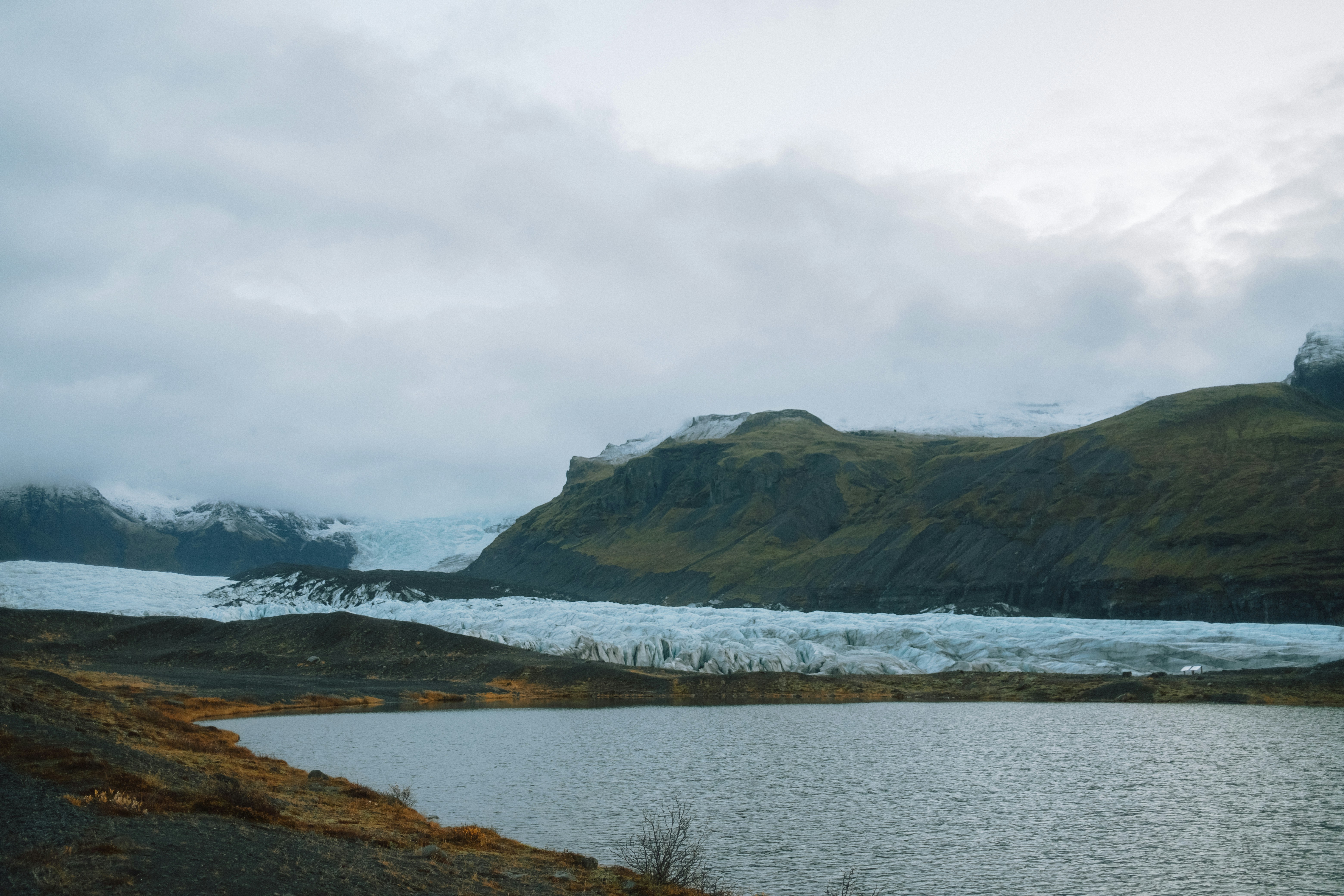 Glacial shoreline under overcast skies