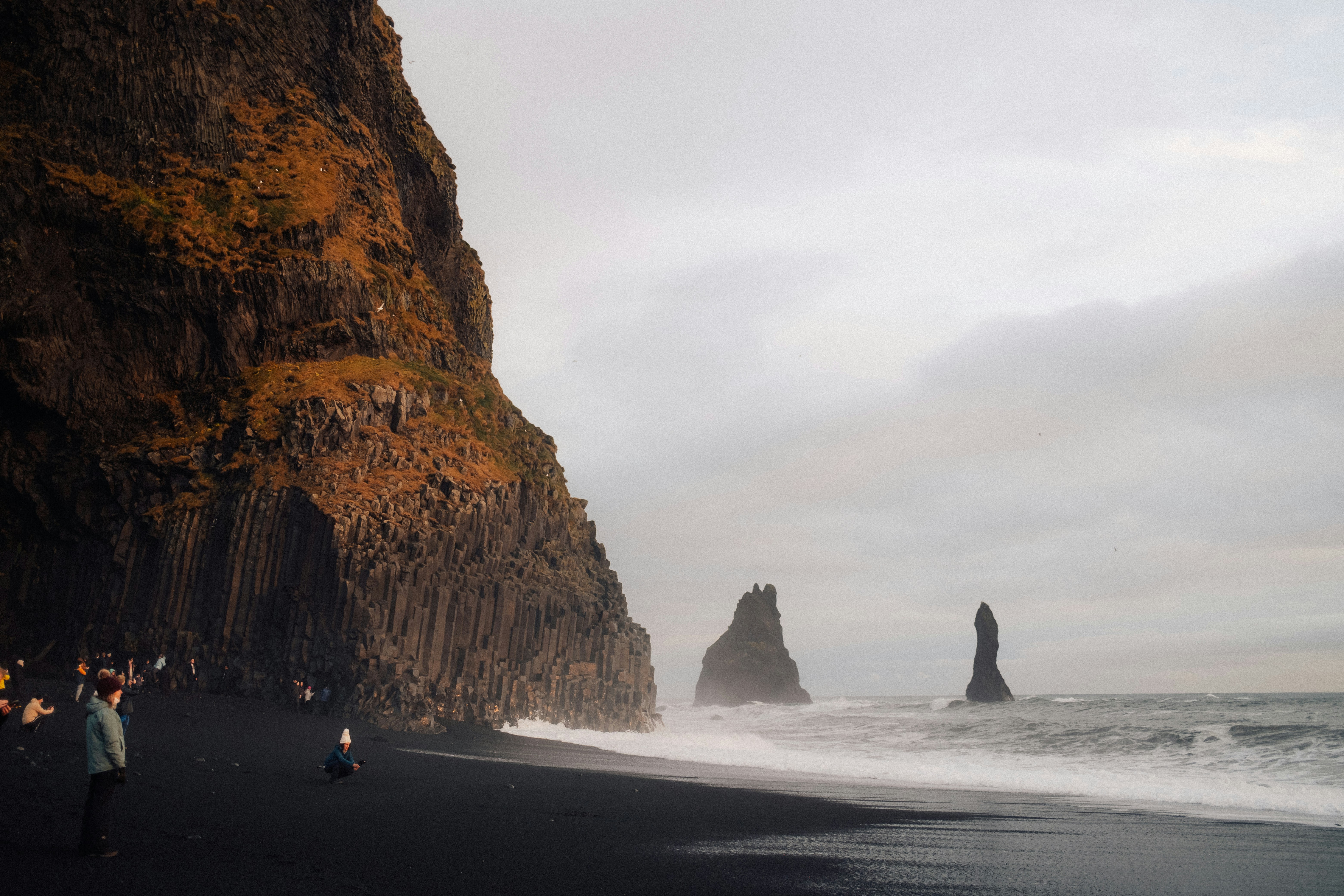 Dark Shoreline Giants: Basalt Columns and Sea Stacks at Dusk