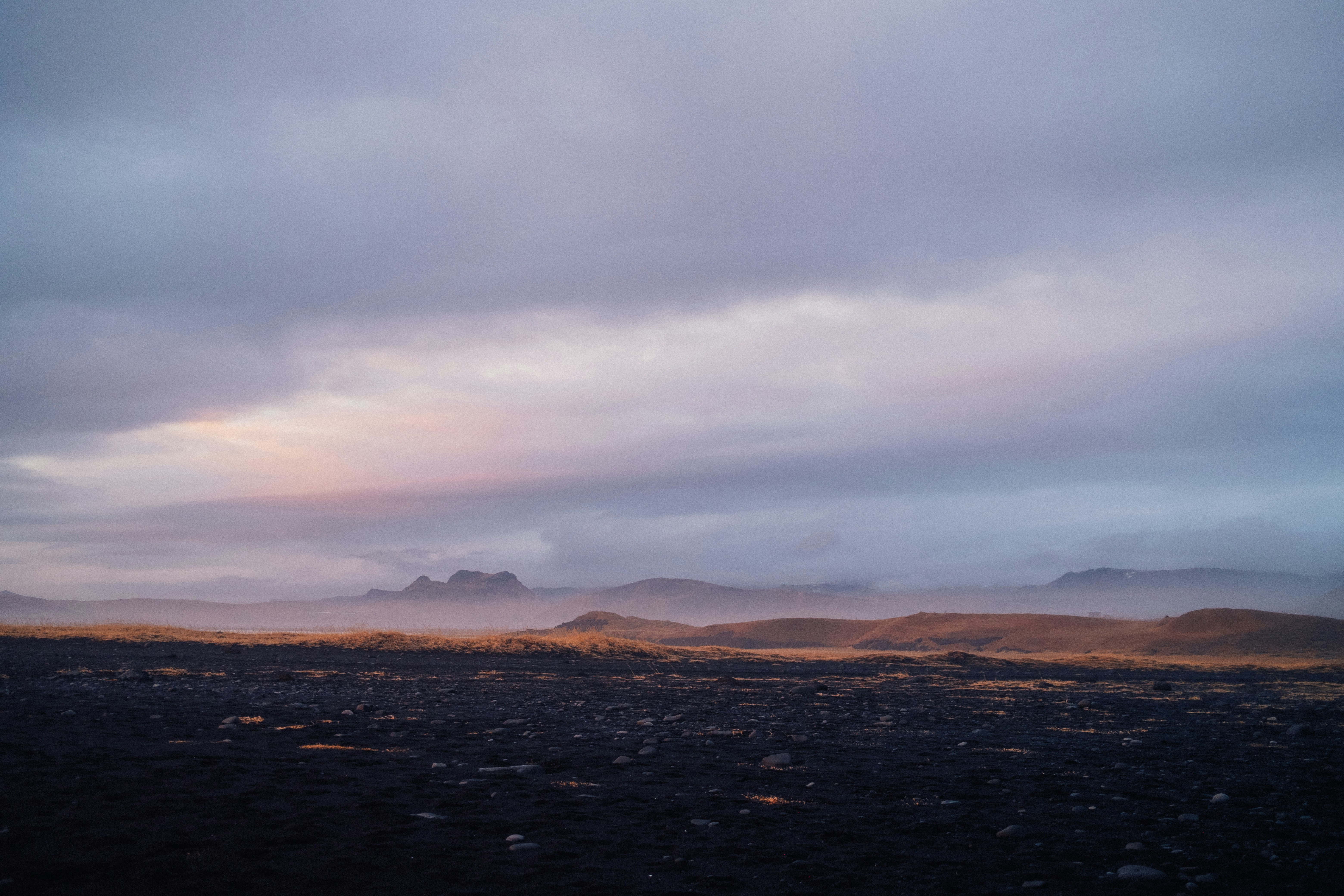 Dawn over the Volcanic Plain: Soft Light on Dark Ground