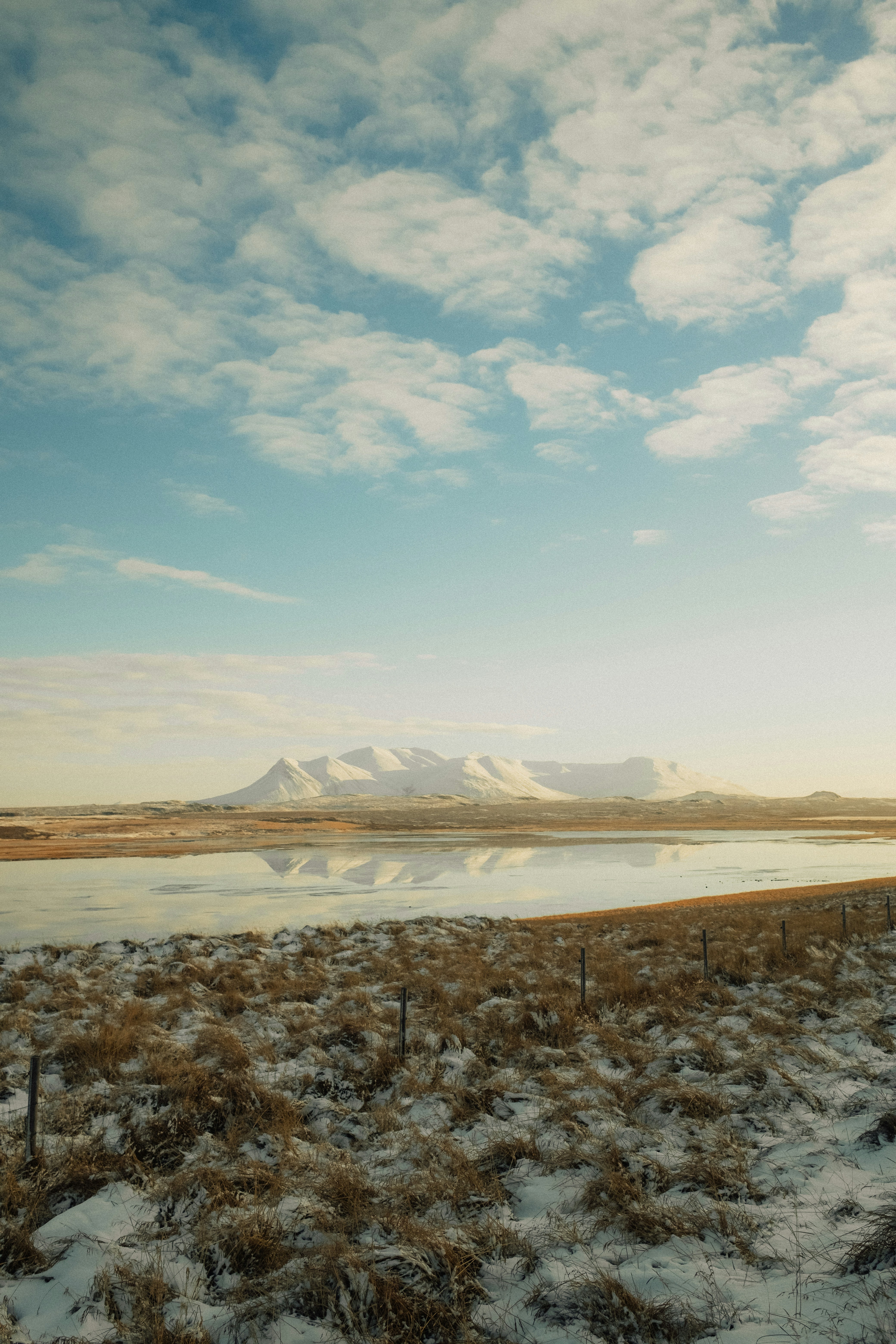 Snow-kissed Plains Under a Quiet Sky