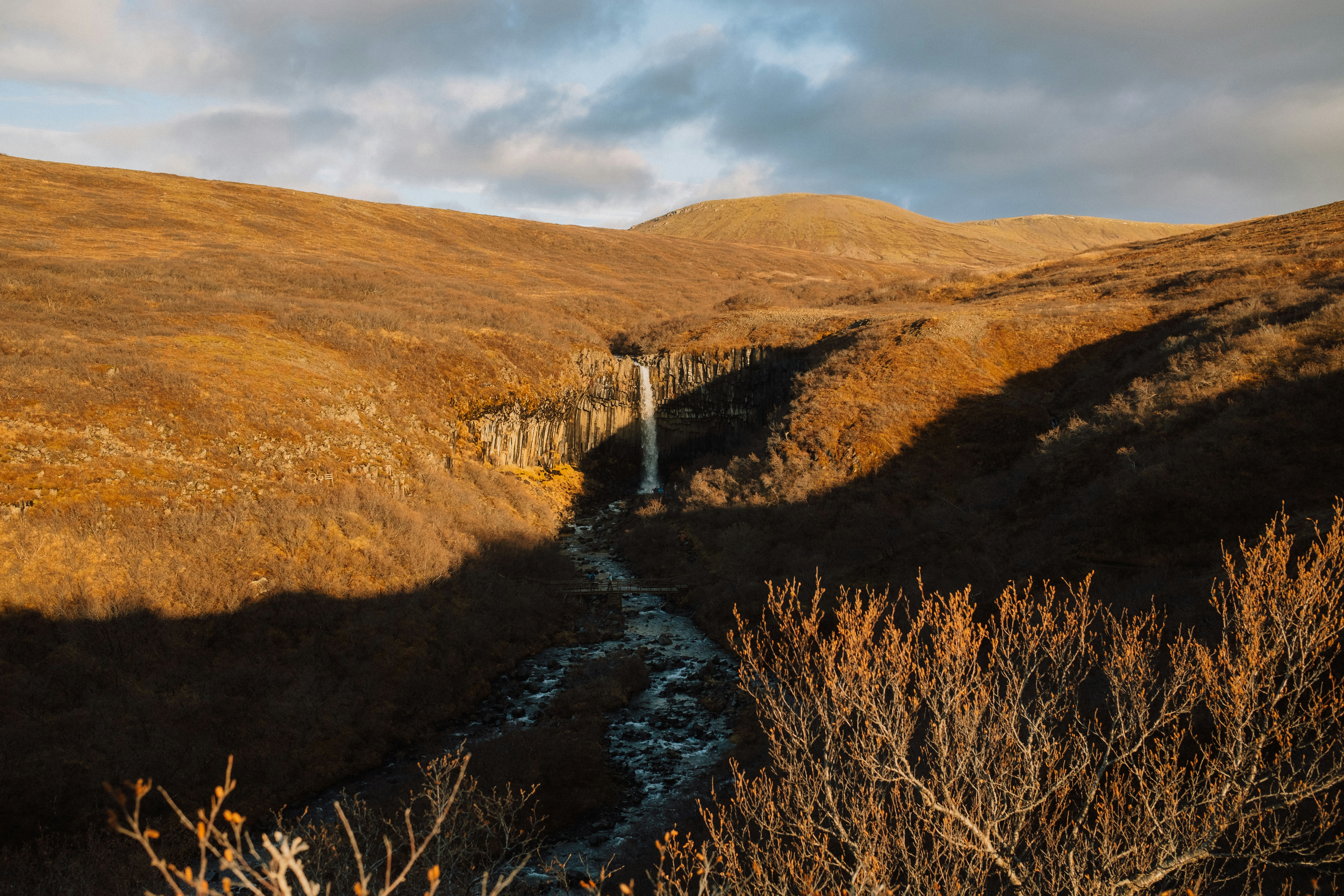 Golden Hills Over a Quiet Vale with a Veiled Creek