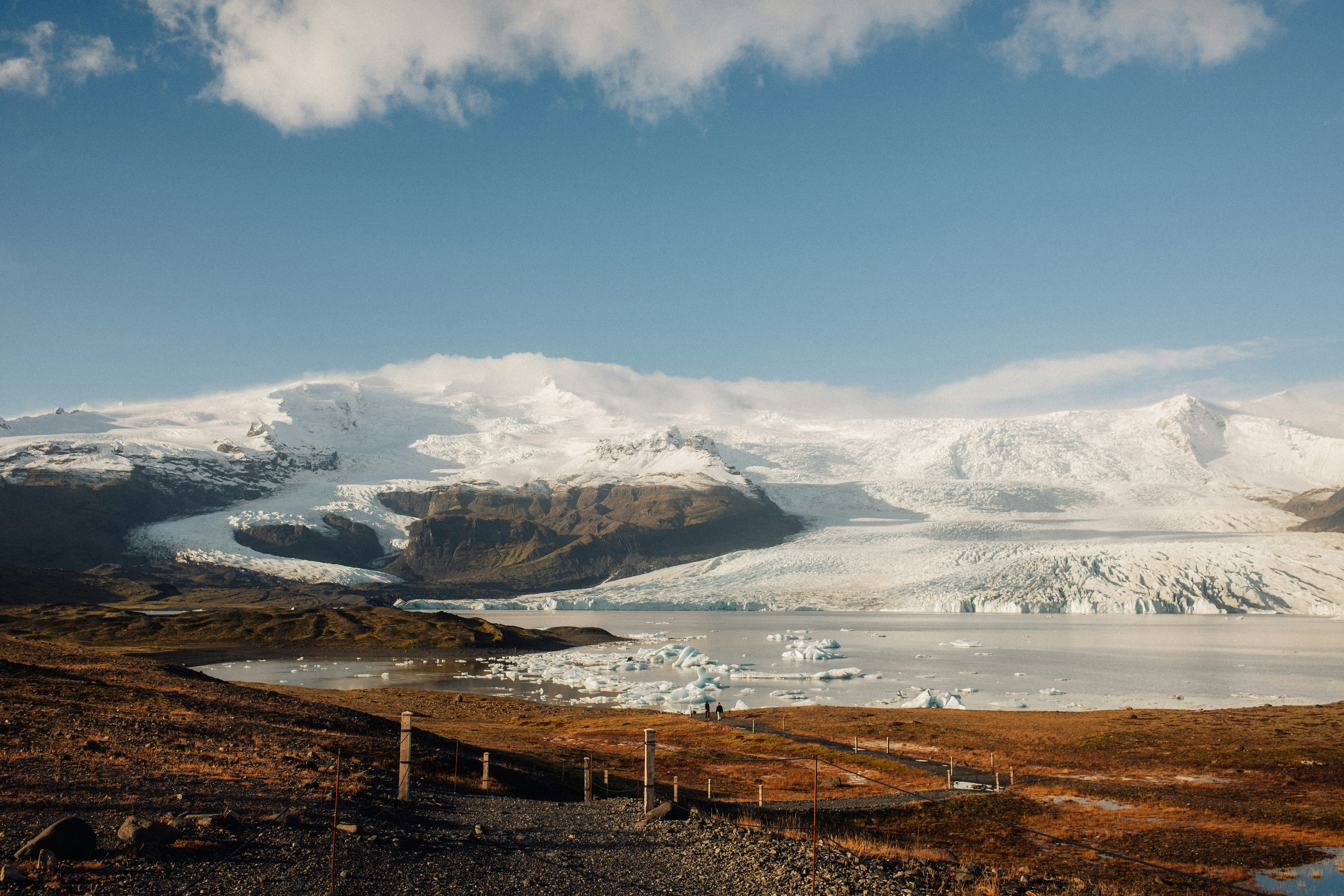 Glacial Front at Dusk: Rust and Ice Meet the Fjord