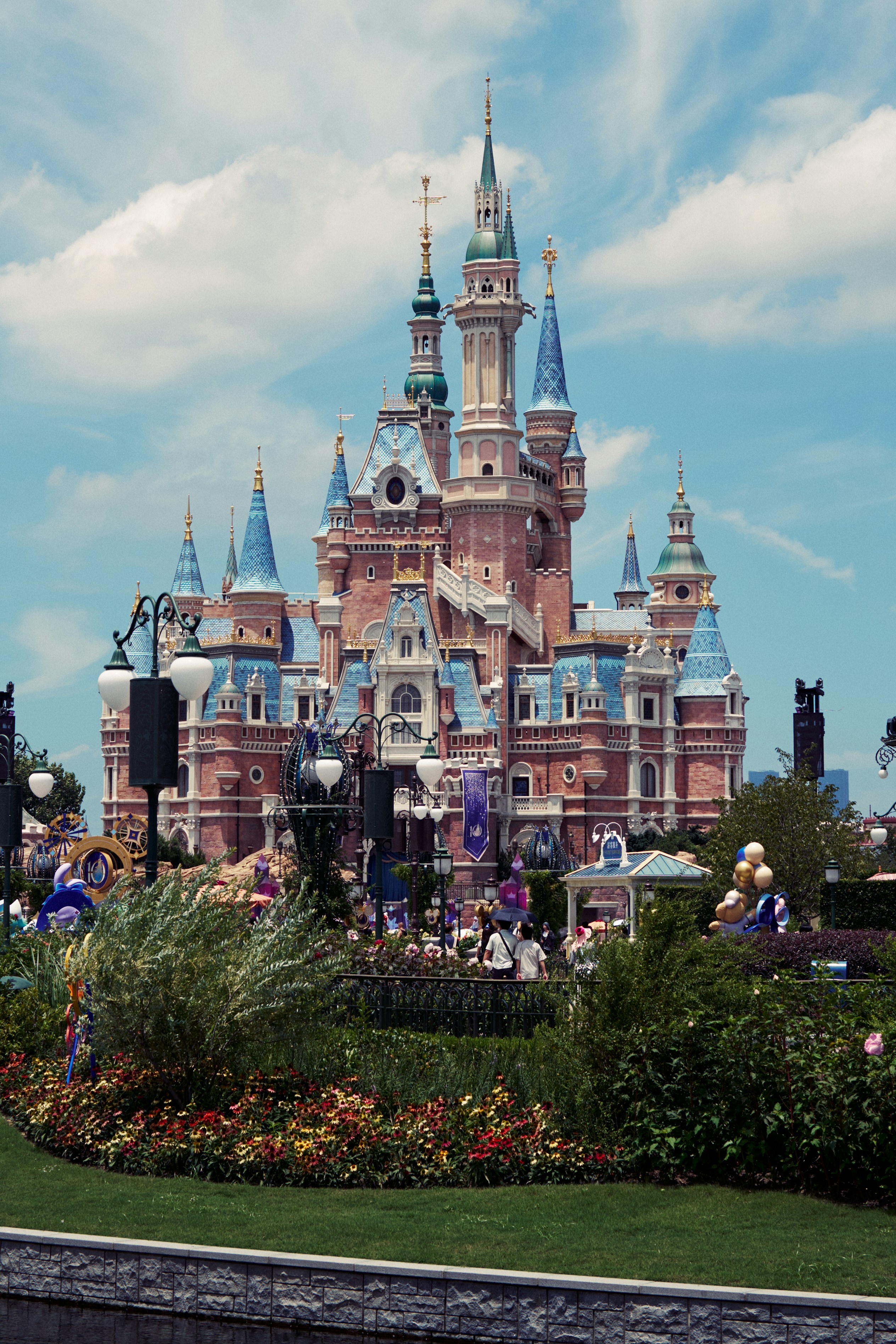 The Enchanted Storybook Castle with blue spires and brick walls in Shanghai Disneyland