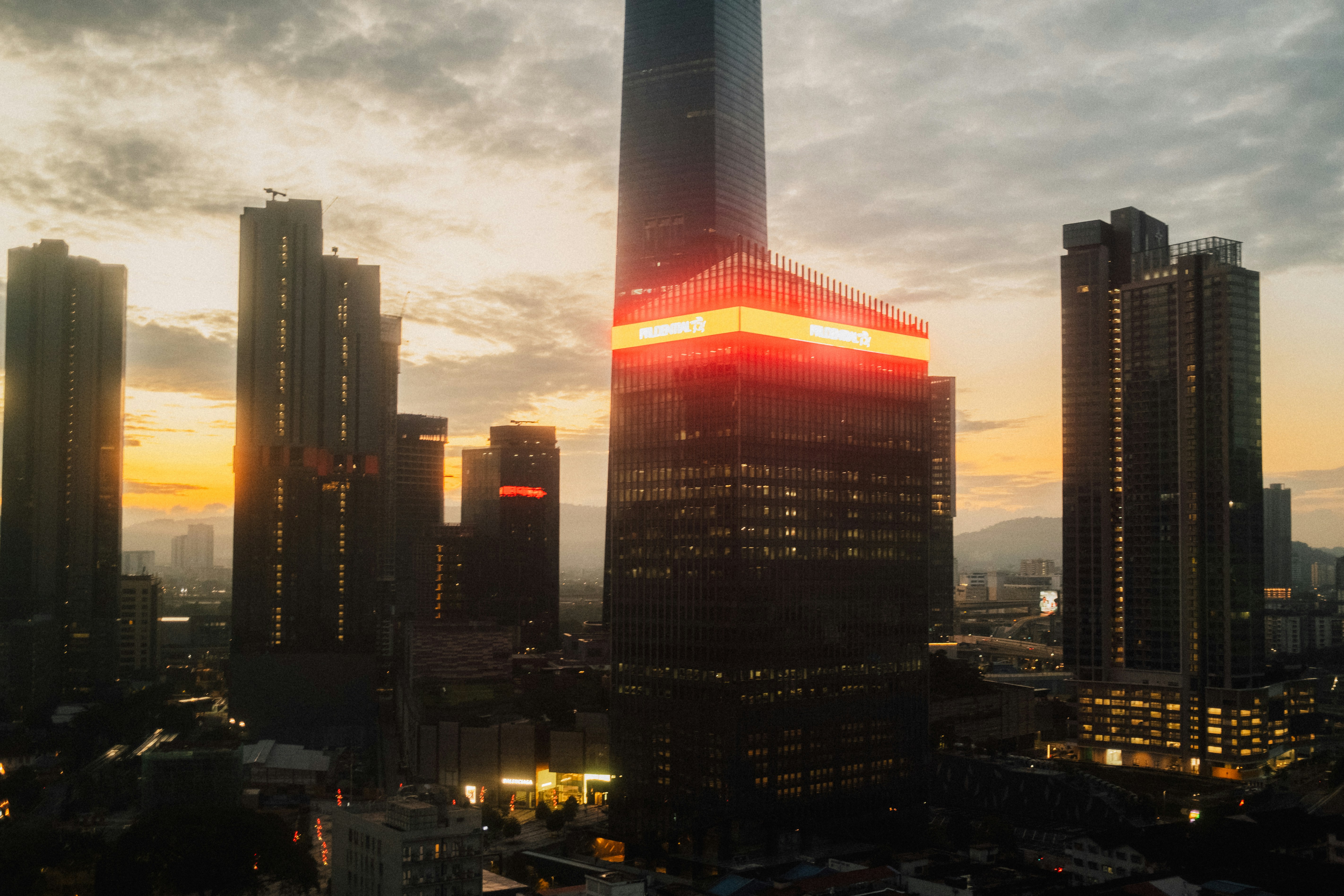 Neon Ringed Tower at Sunset
