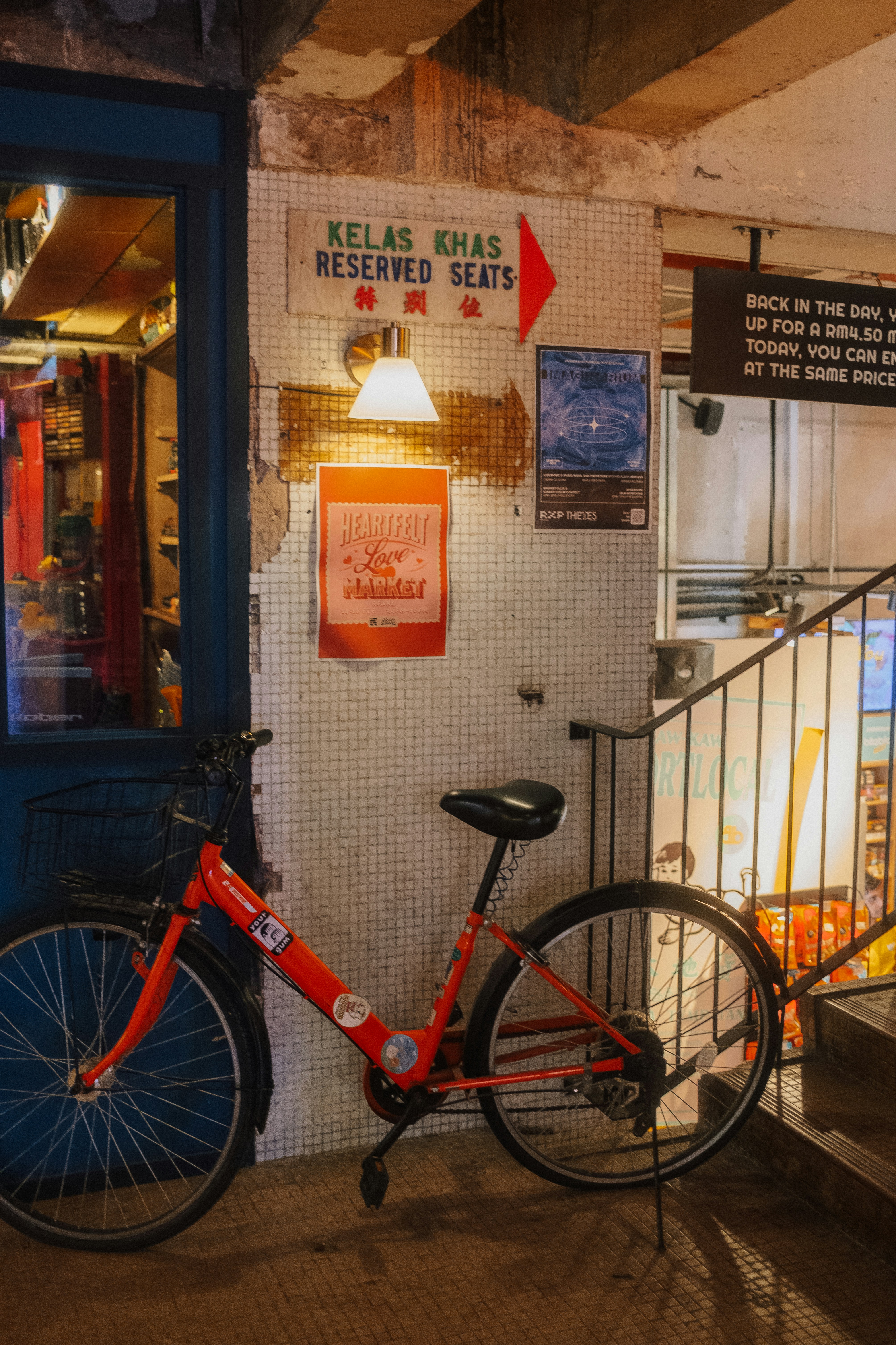 Red Bicycle by the Neon-lit Café Wall